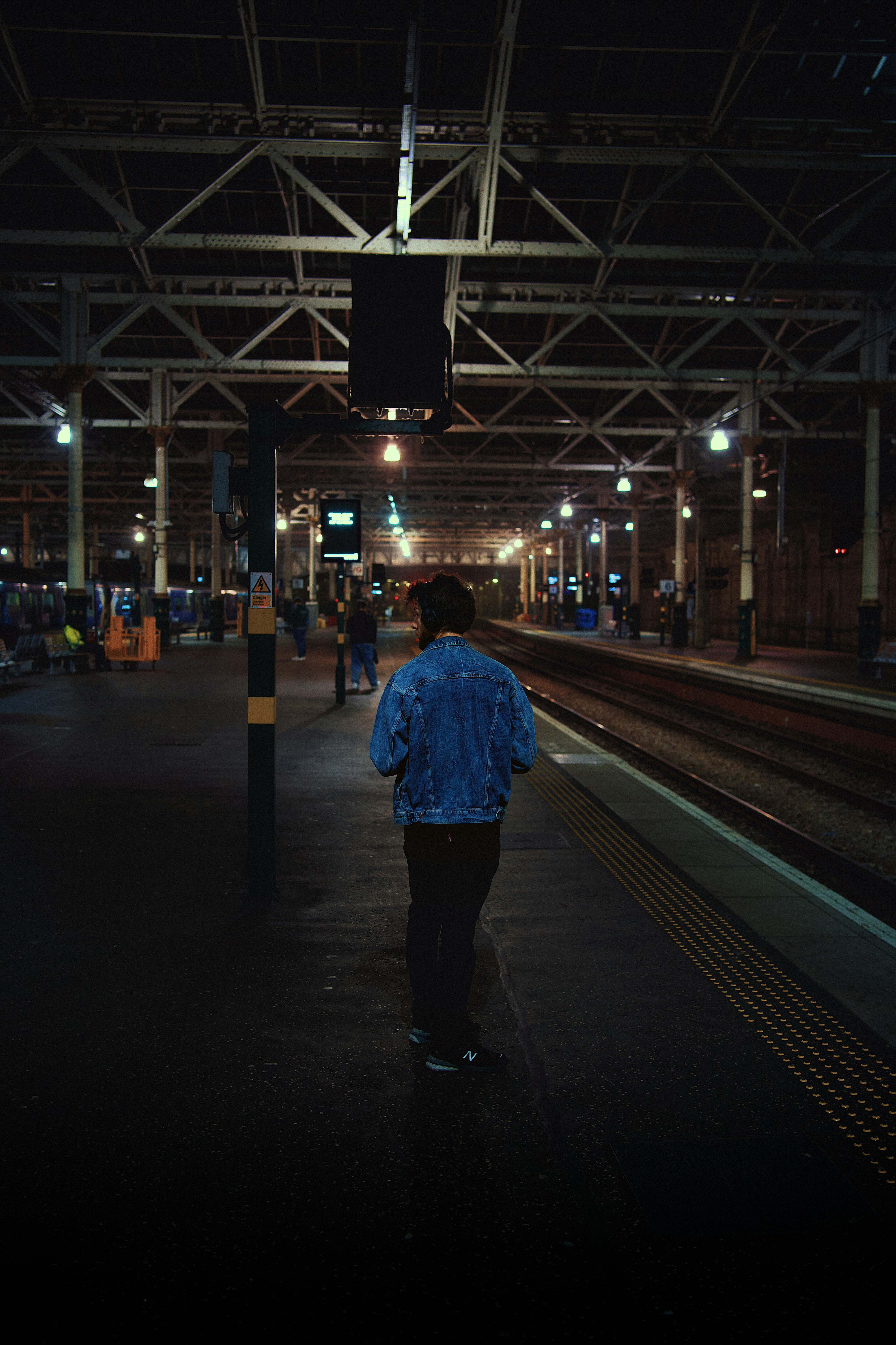 Midnight Departure at the Station: Blue Denim in the Neon Echo