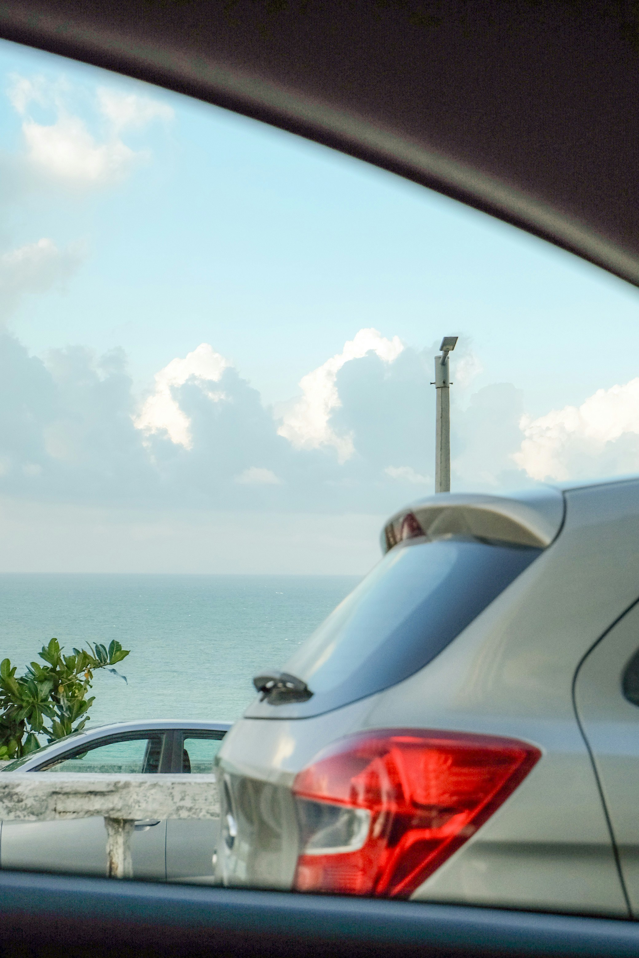 Car Tail in Ocean Breeze: A Quiet Car Portrait by the Sea