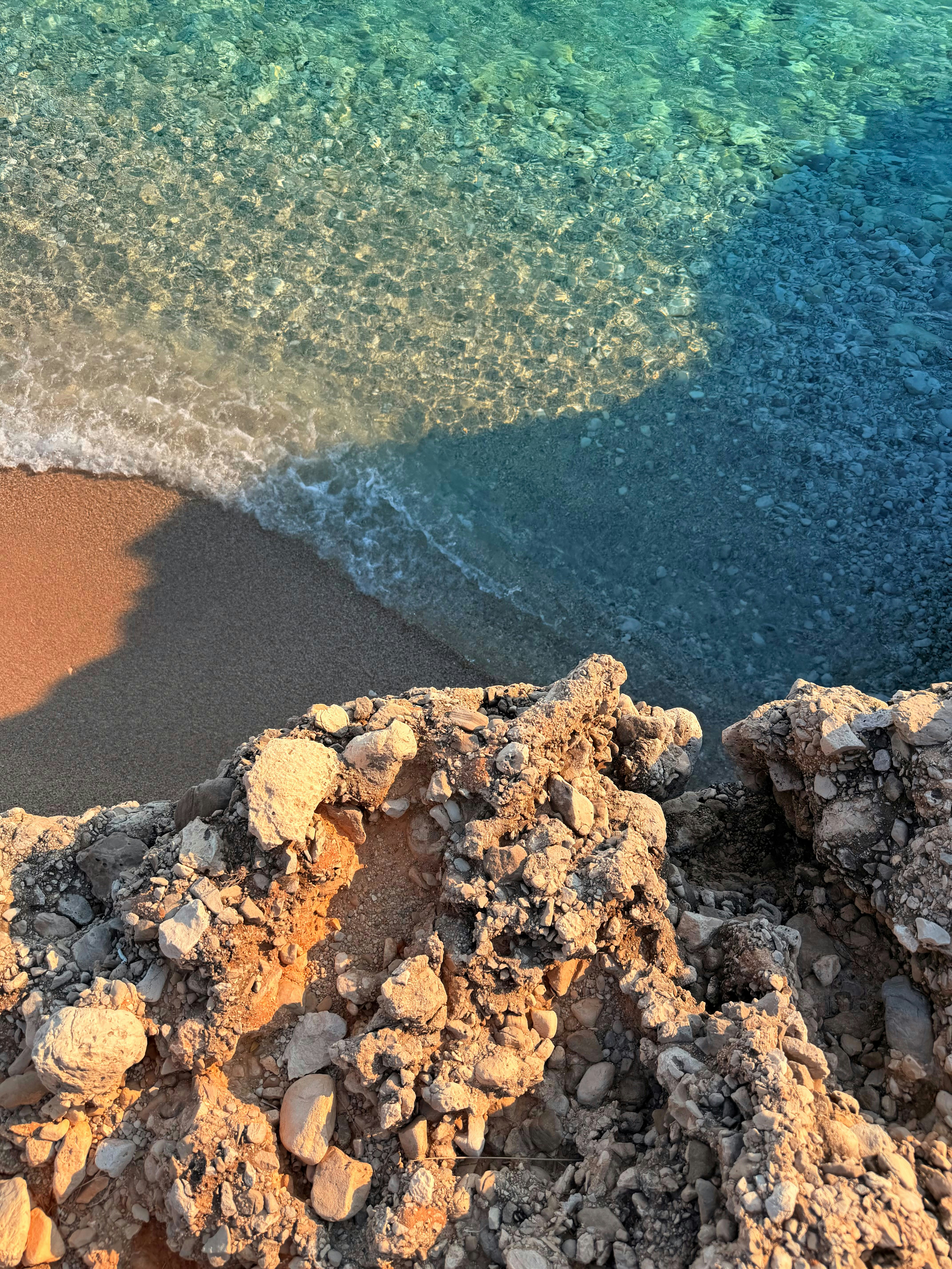 Cliff Creek: Rock Fragments Over Turquoise Tide