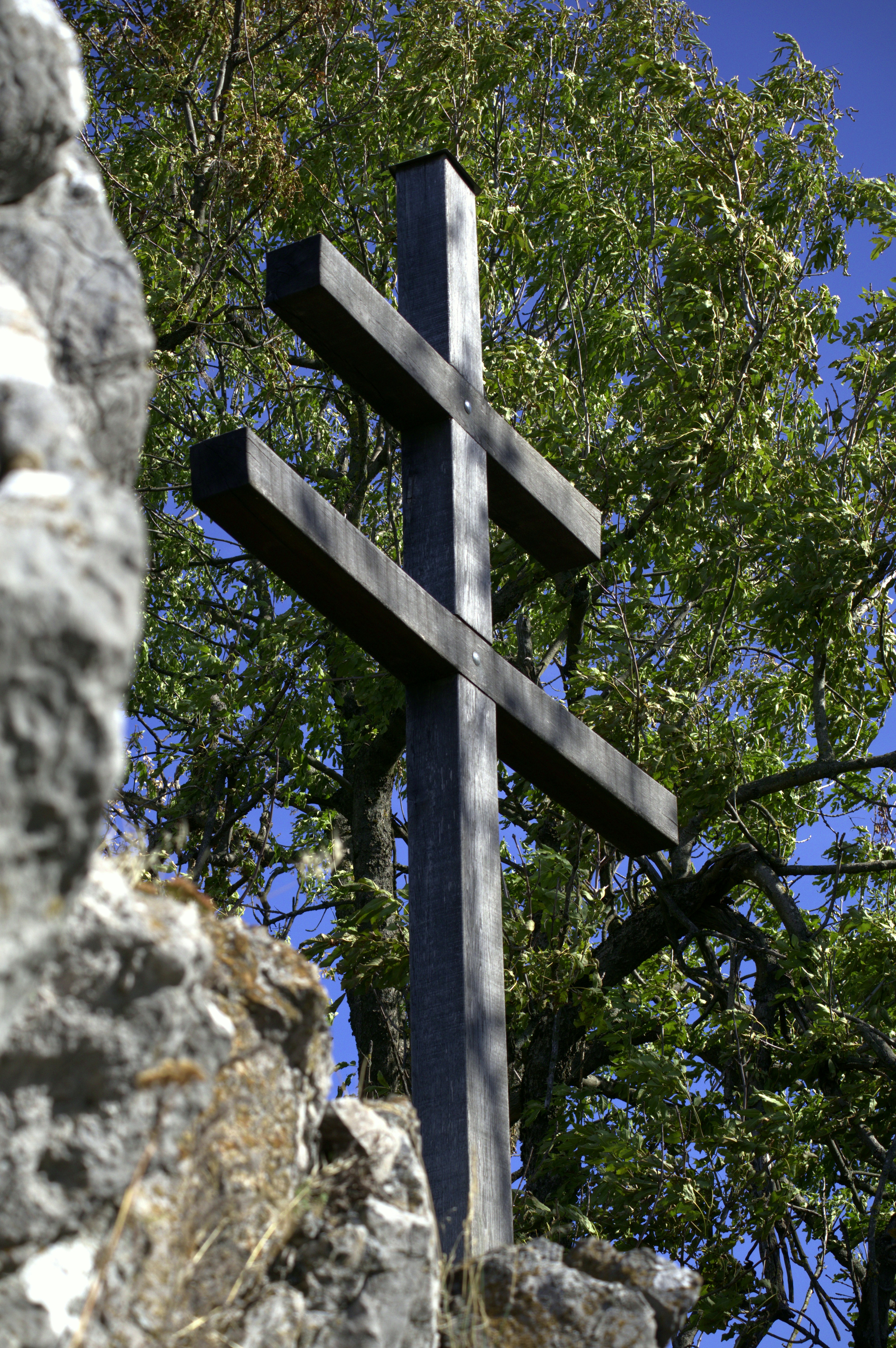 Crossing Granite: A Quiet Crosstower Against a Bristling Sky