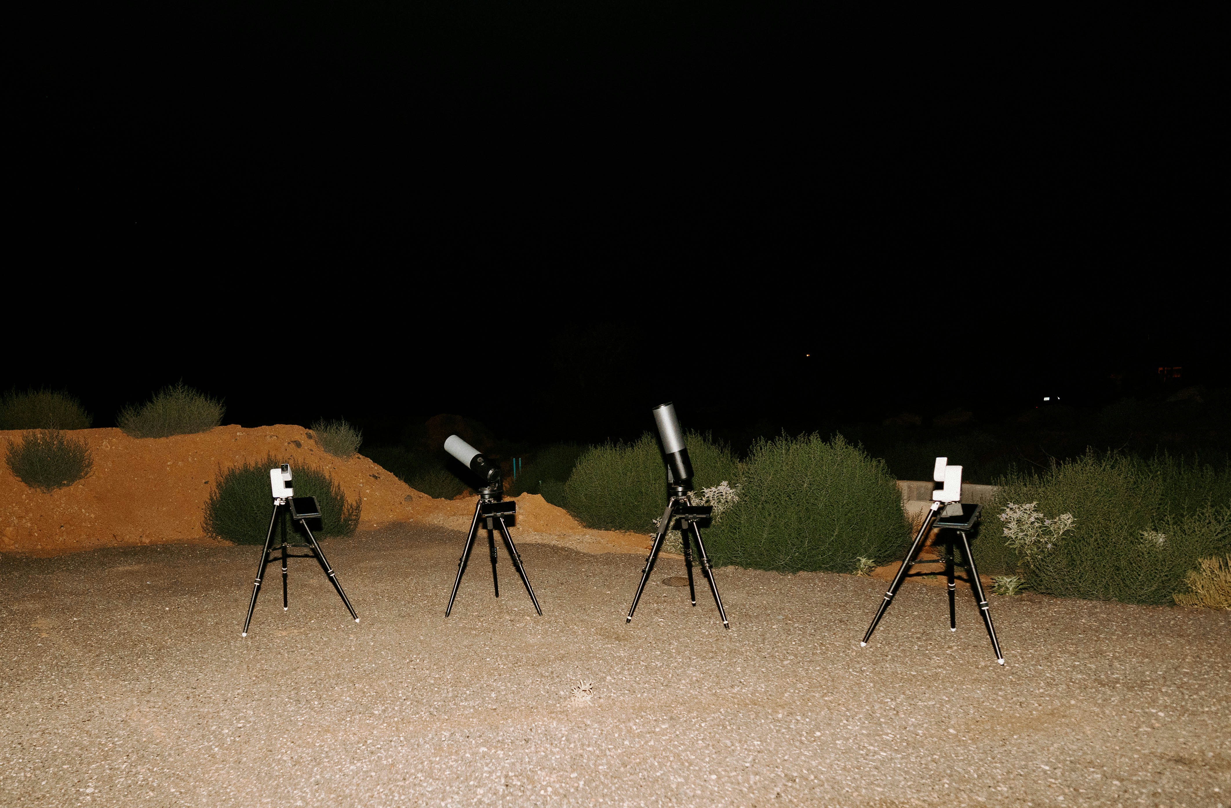 Five Telecopes Silhouetted against a Night Sky