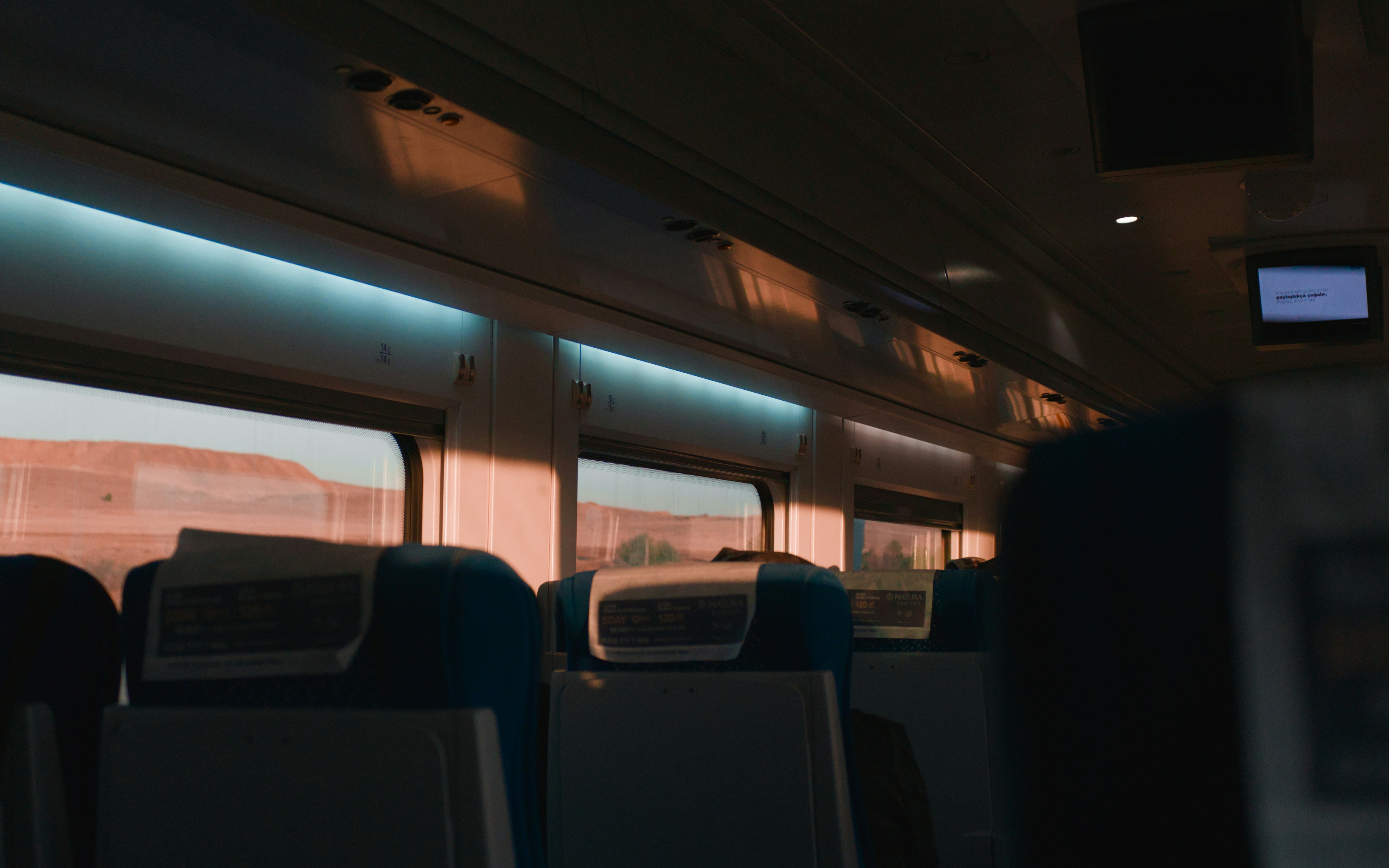 Sunlit Aisle: Quiet Morning Light Through Bus Windows
