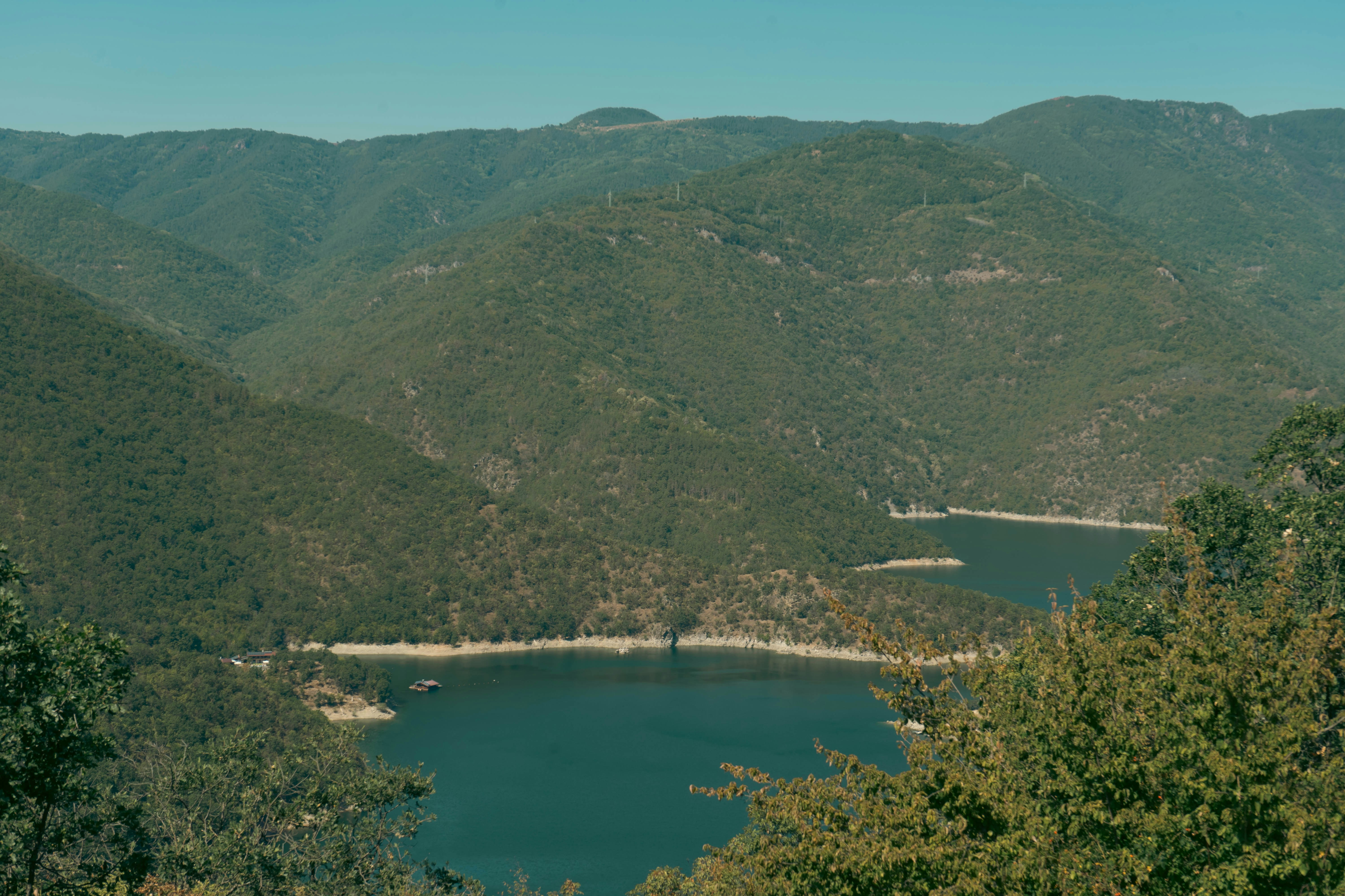Serene Lake Between Green Ridges