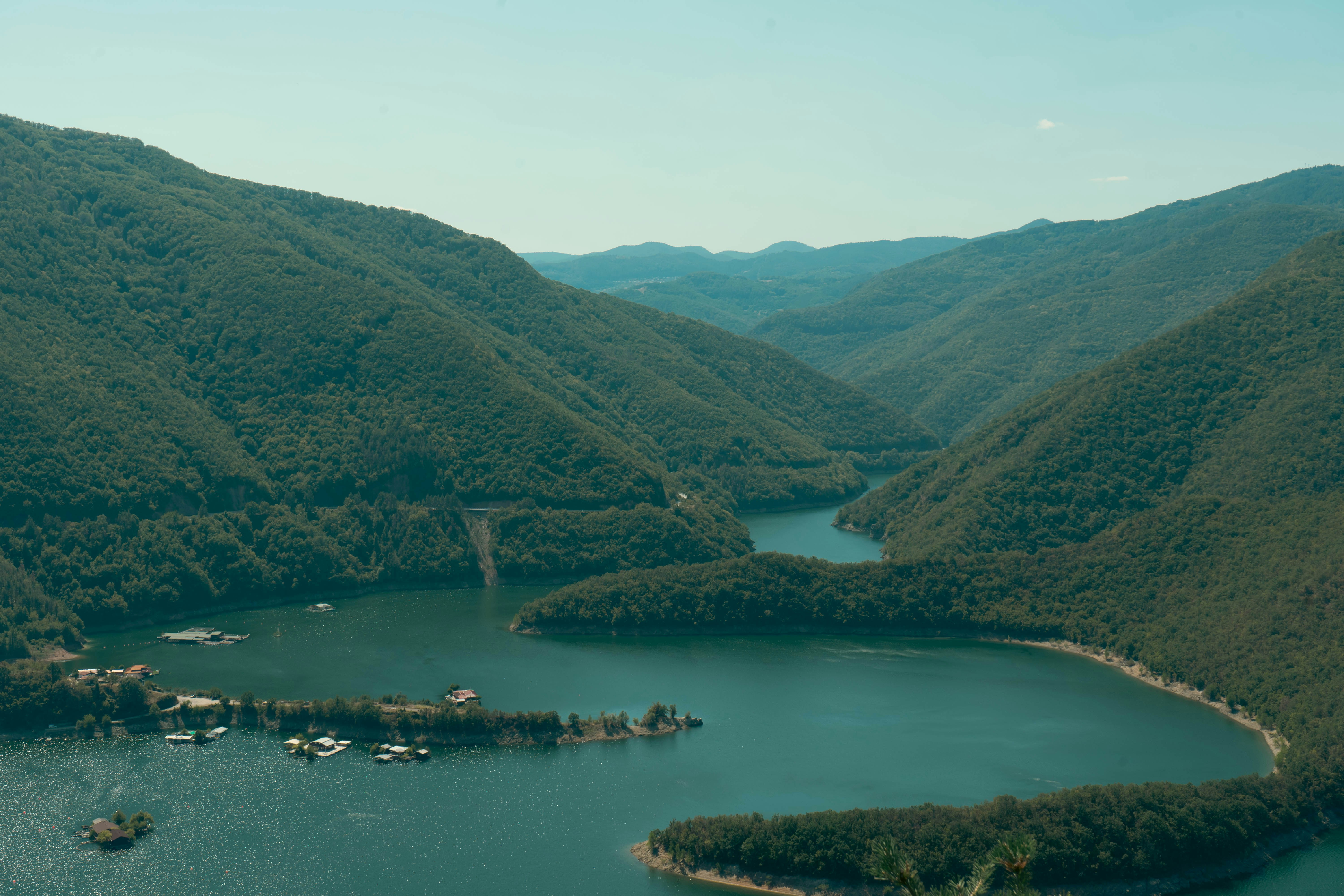 Serpentine Reservoir Through a Mountain Corridor