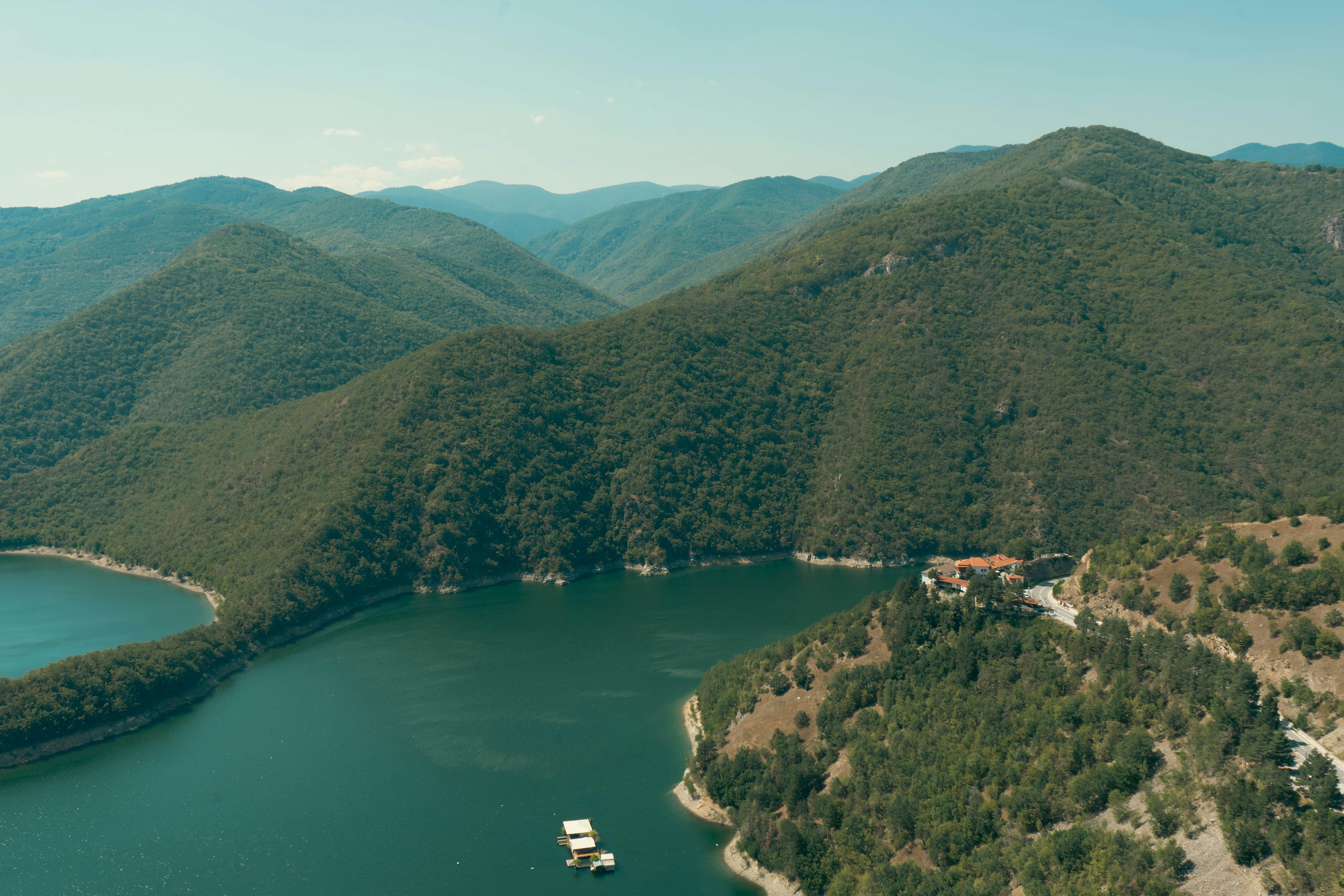 Verdant Fjord Aerial: Serene Inlet Dotted with Pines