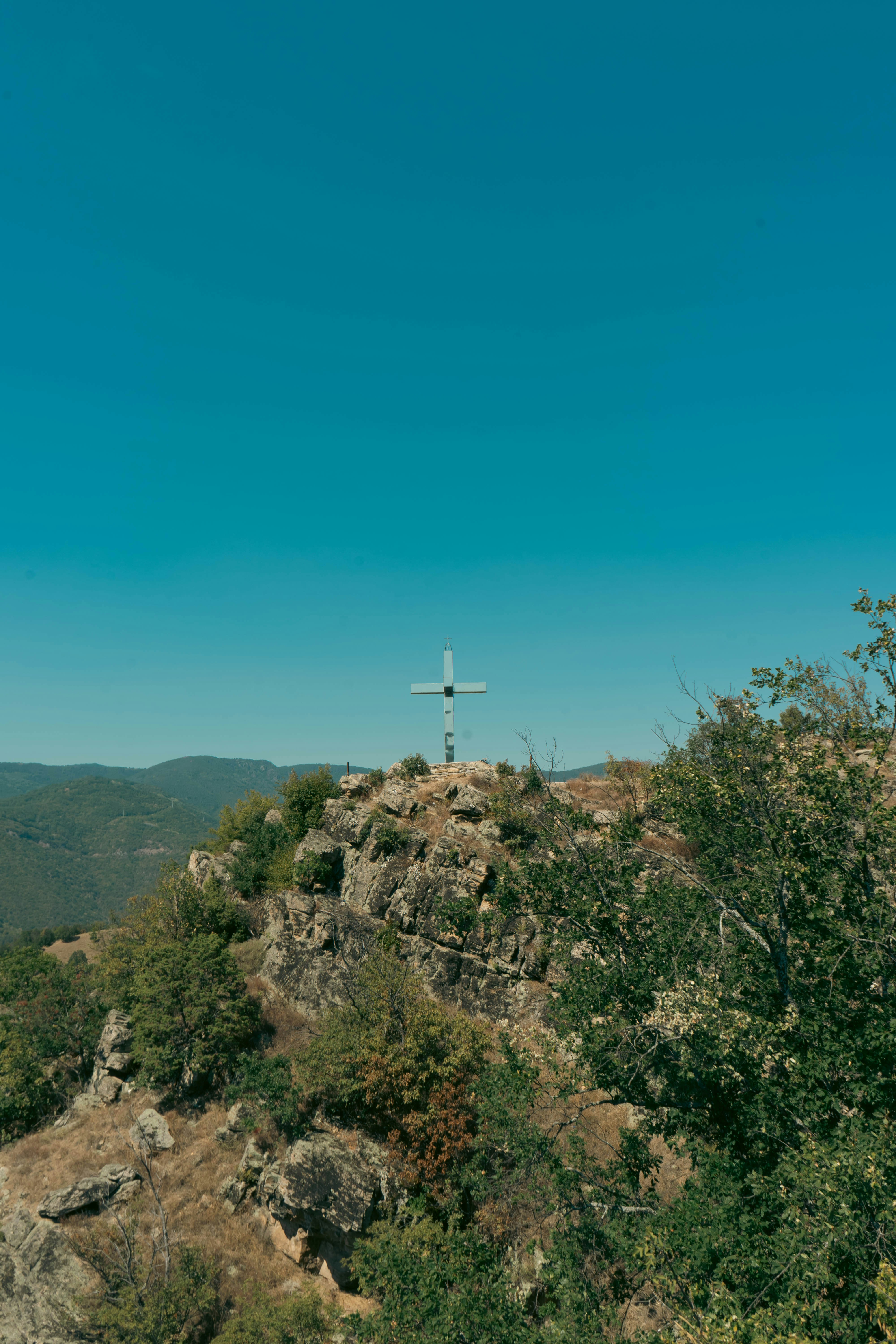 Cross on the Crest: A Quiet Summit Watching Over the Valleys
