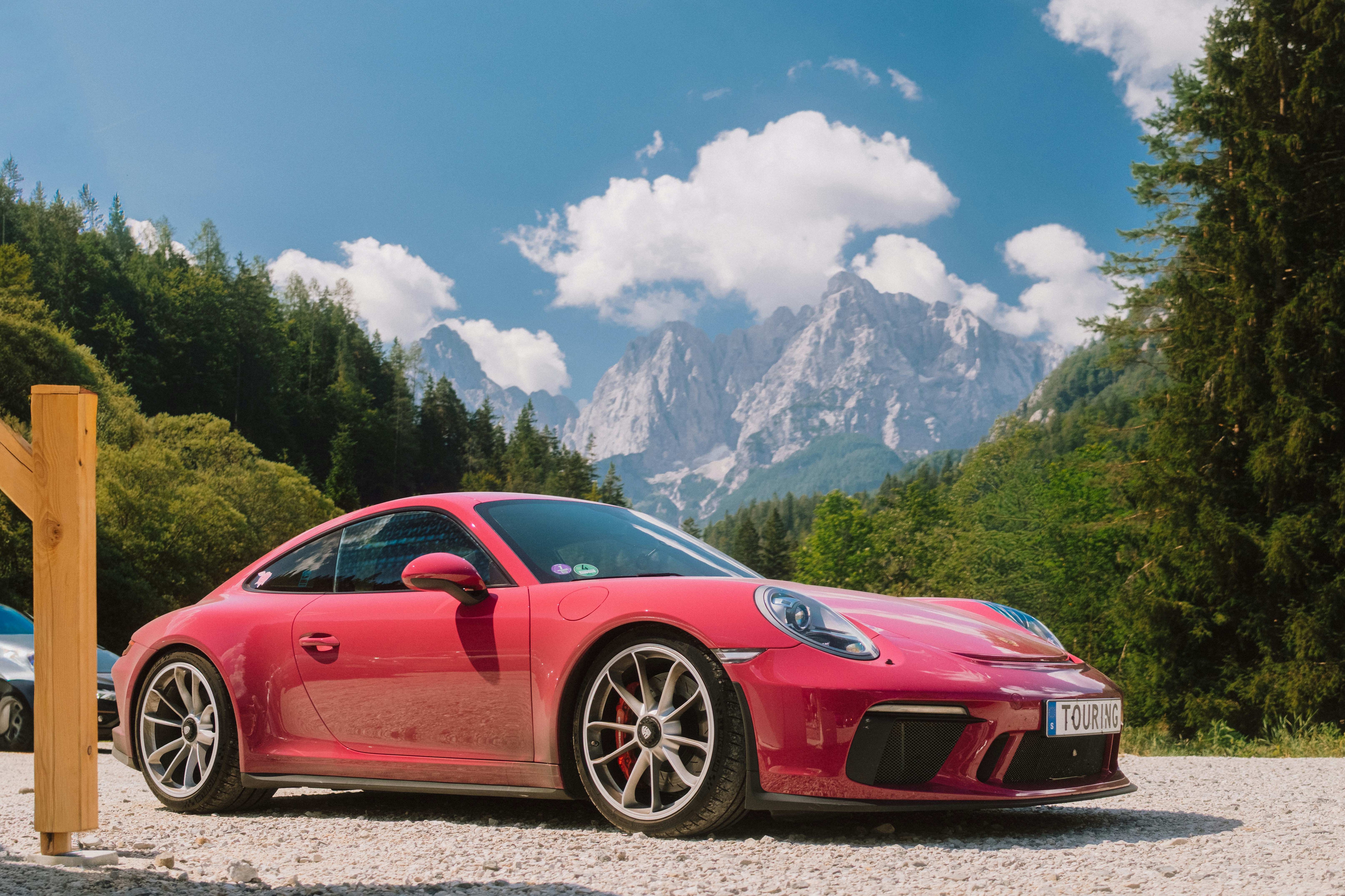 Red Porsche Pierces the Alpine Morning