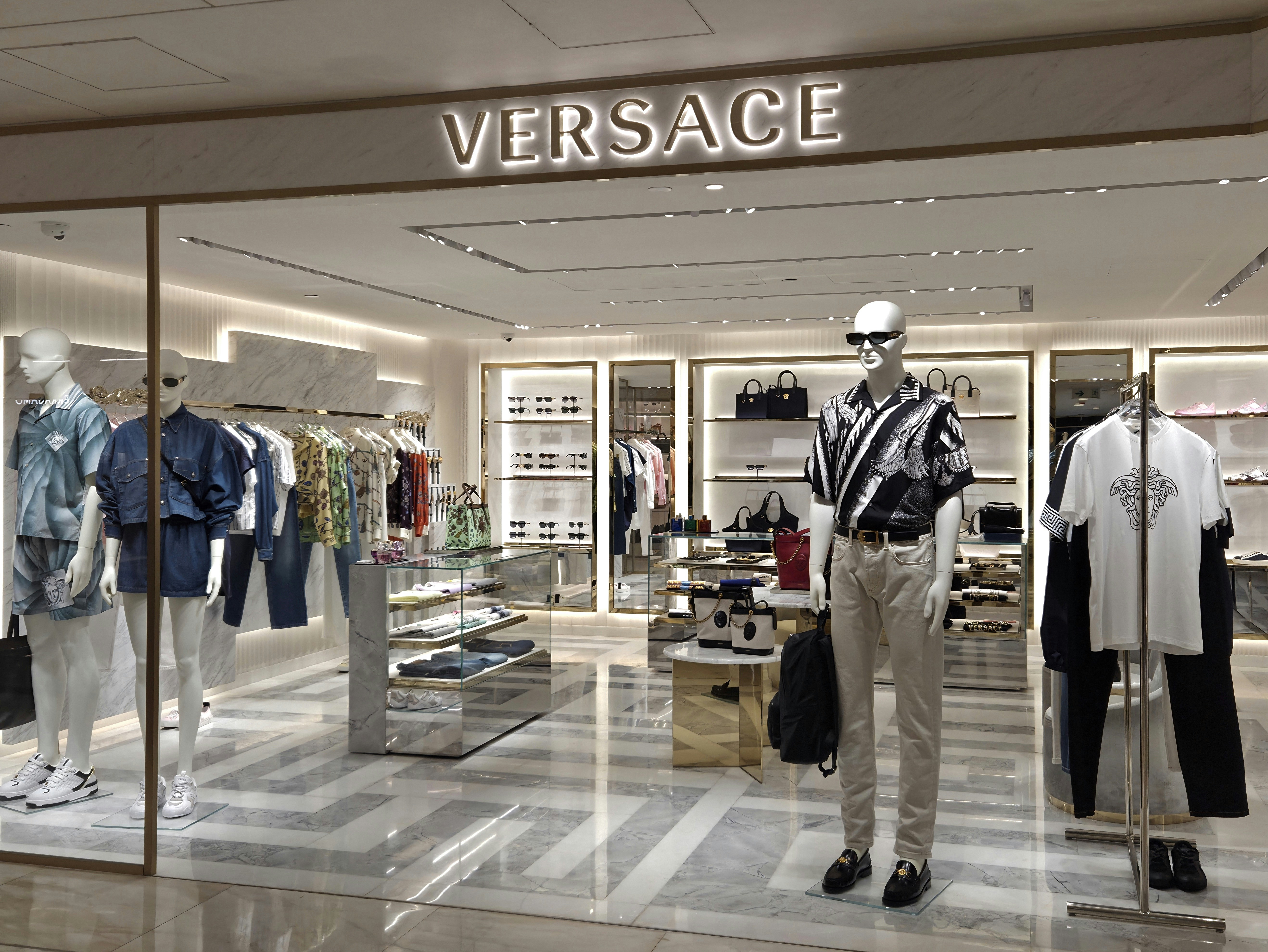 Versace Storefront: Mannequin in Bold Striped Ensemble