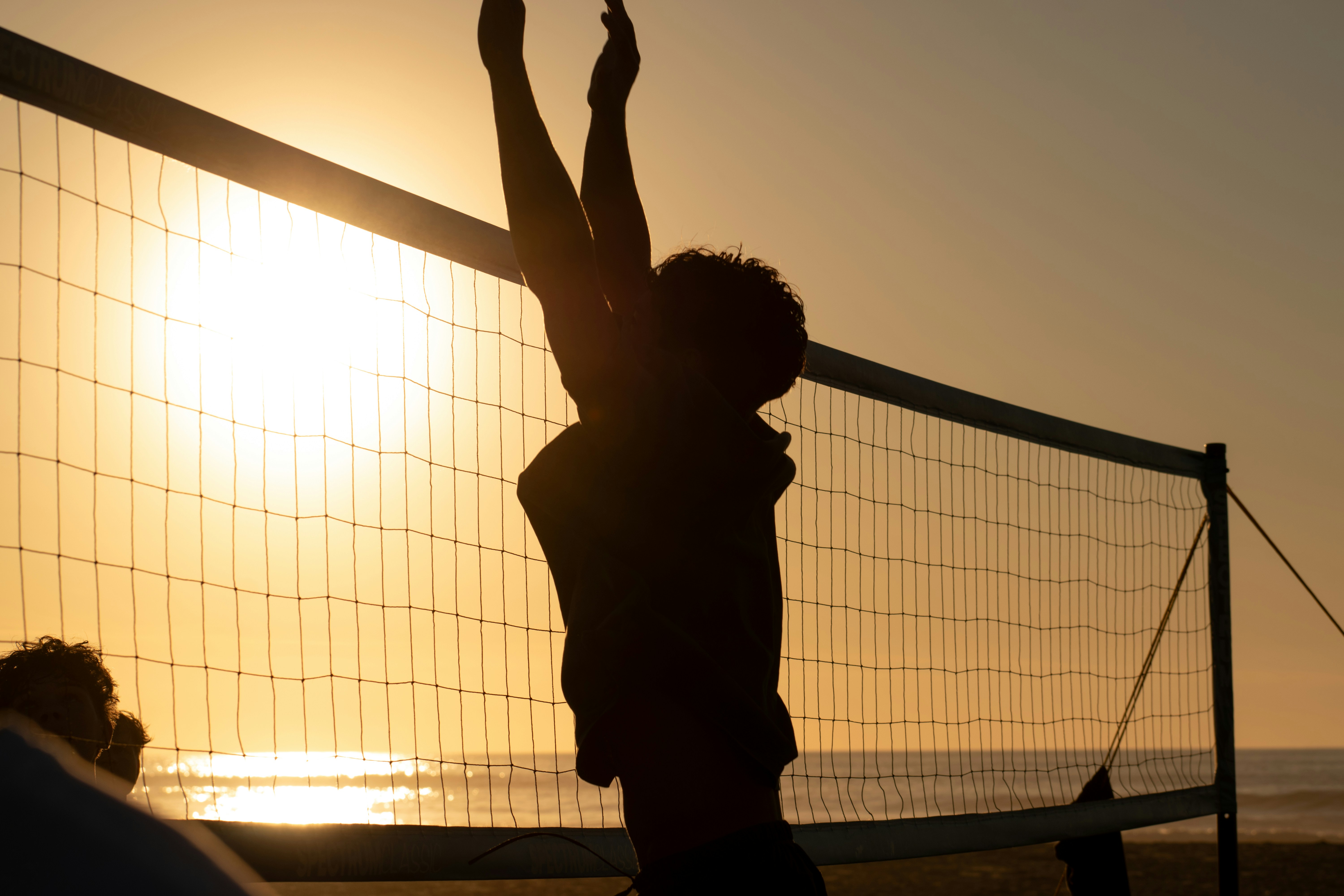 Sunset Spike: Silhouette Against the Net