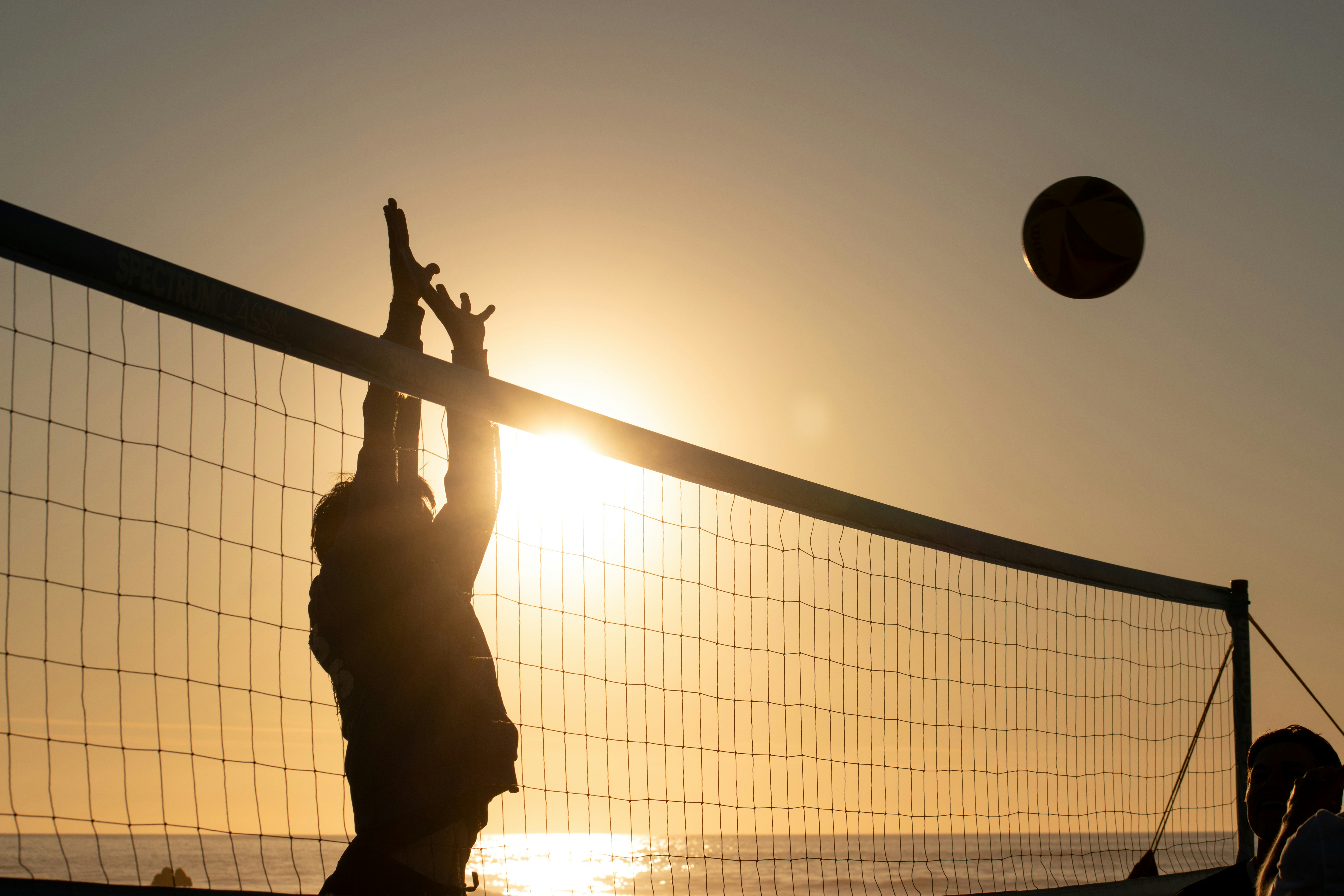 Sunlit Spike: Volley at Dusk