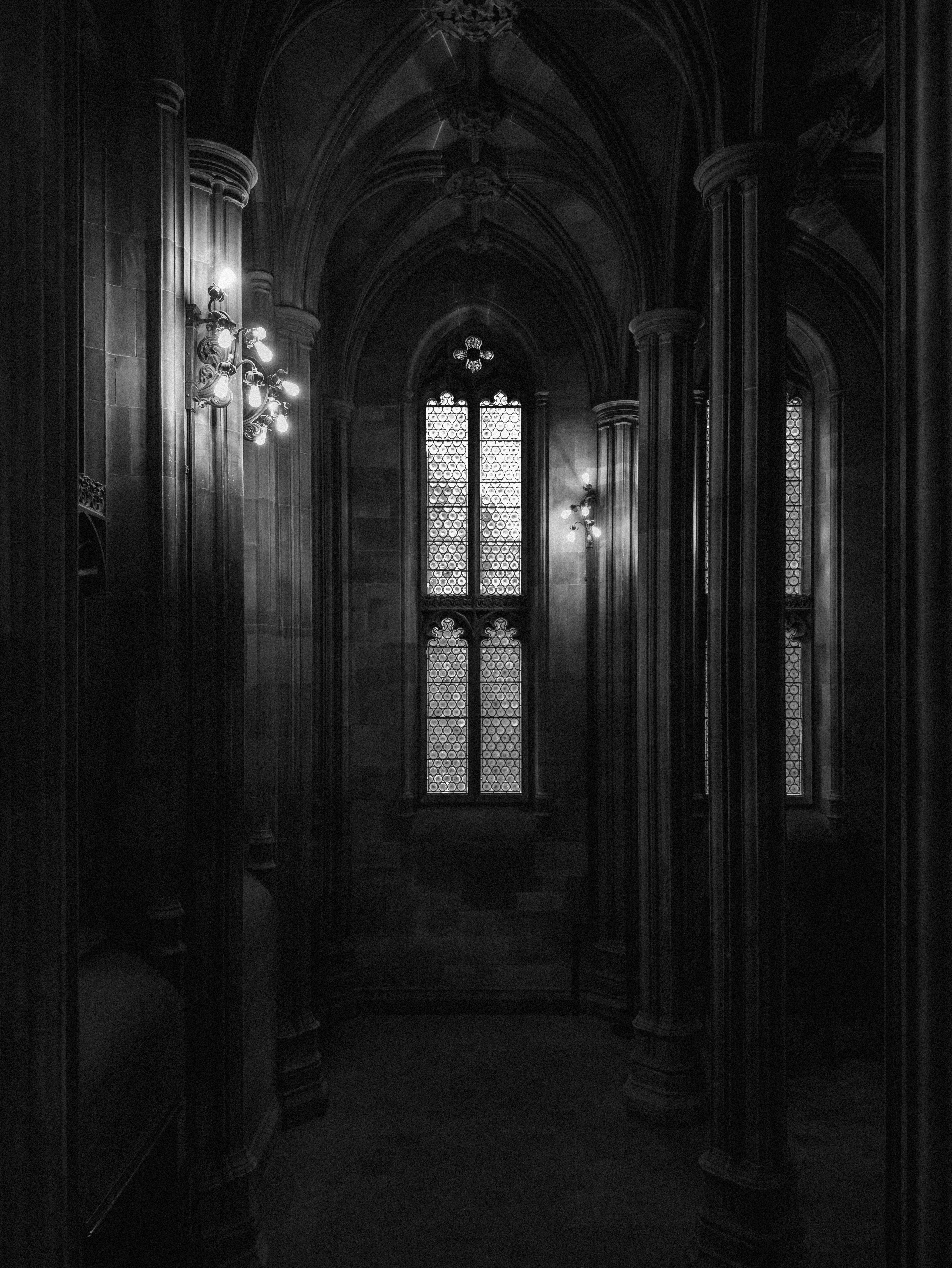 Gothic Corridor of Light: Narrow Vaults and Stained Windows
