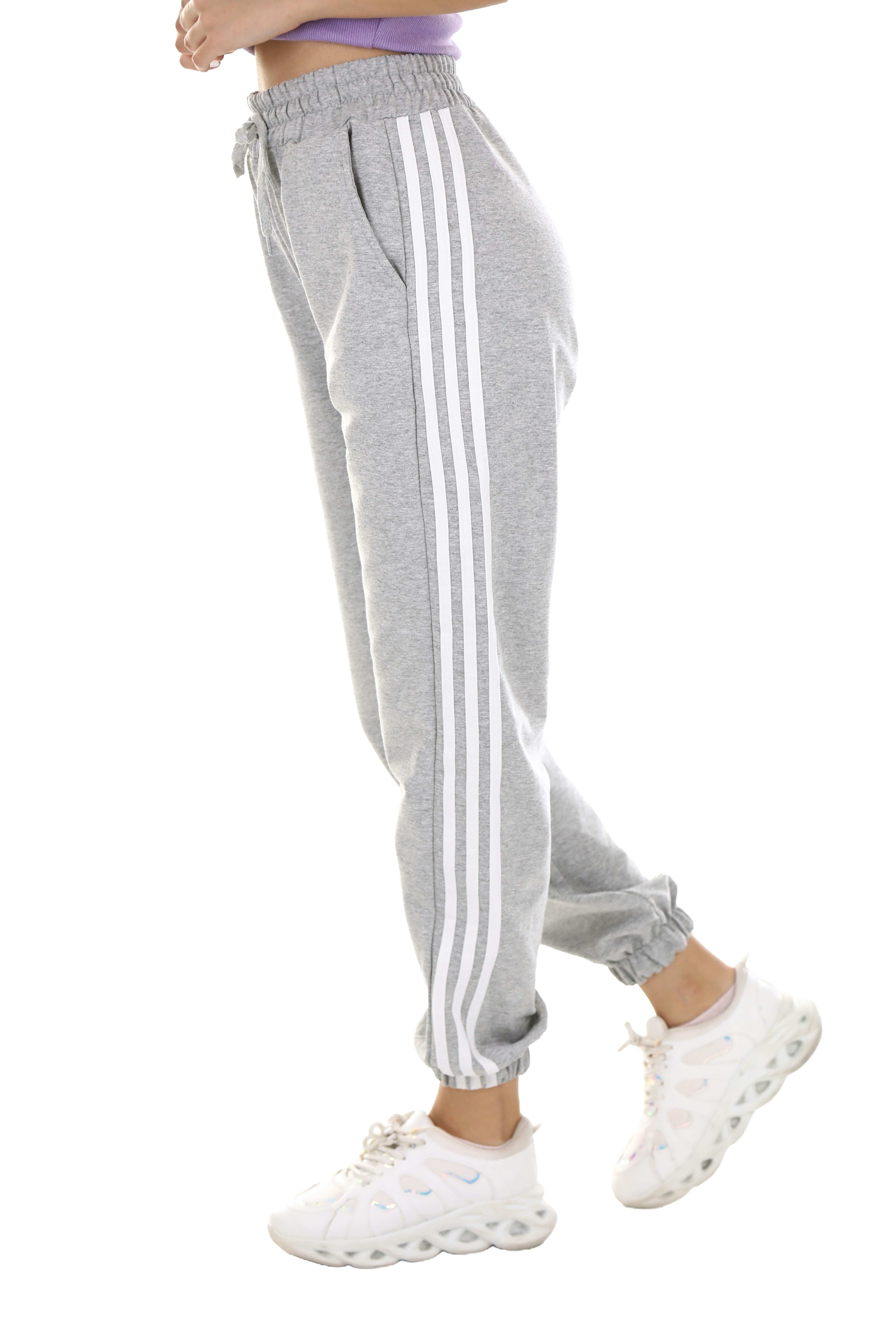 Stride in Soft Grey: Side View of athletic joggers with white racing stripes