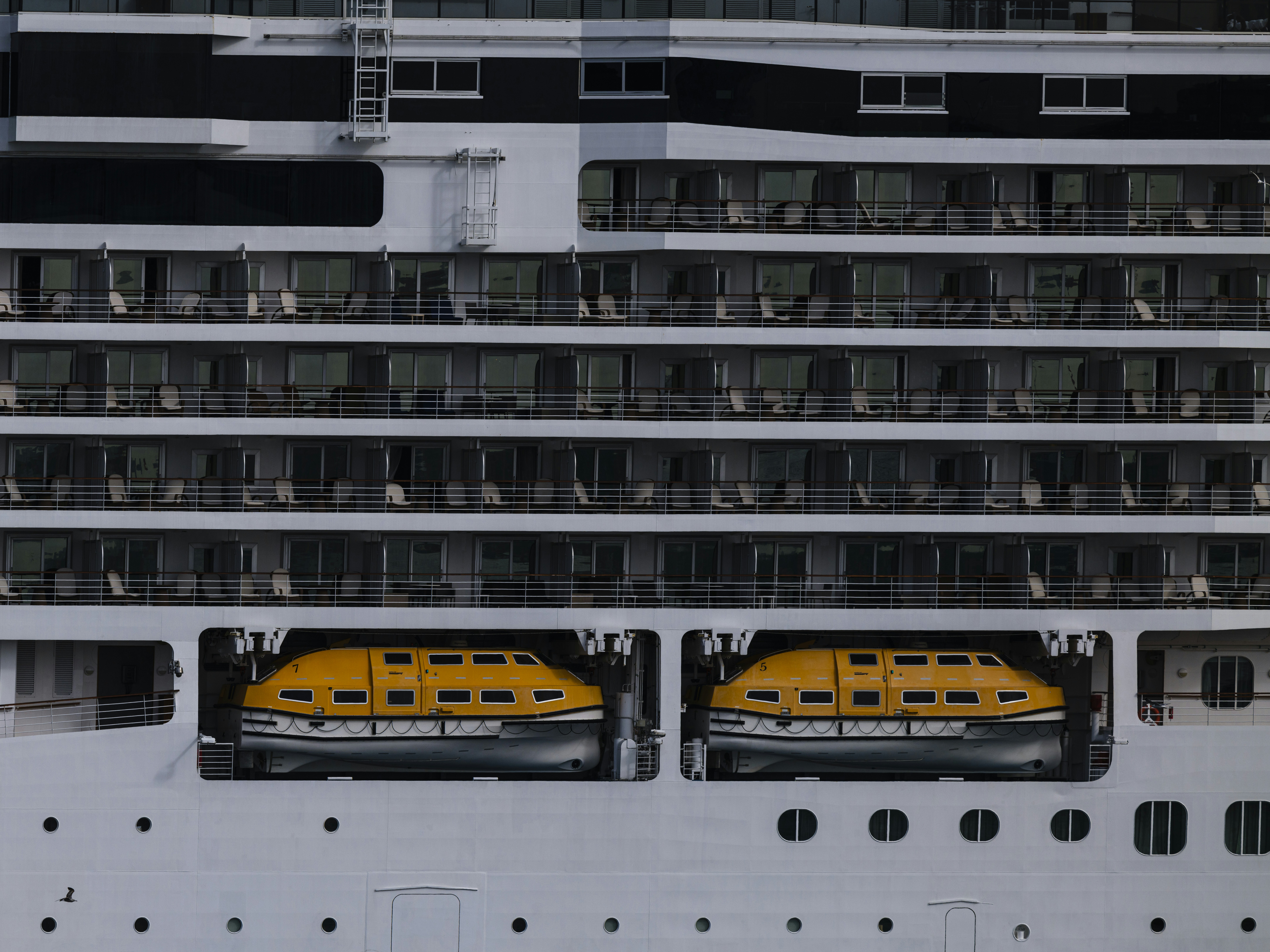 Bright Lifeboats Hidden in Plain Metal: A Ferry Deck Close-Up