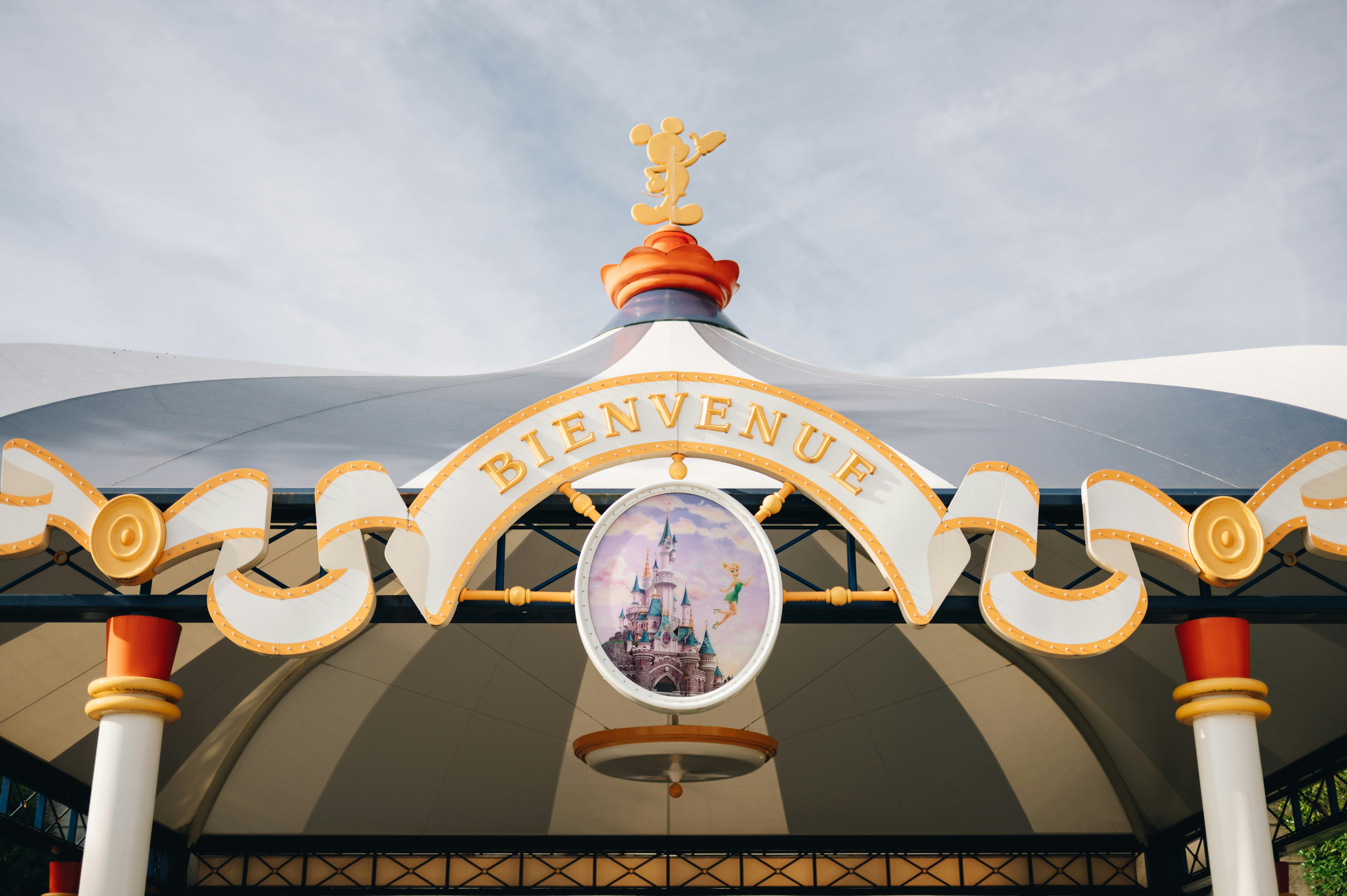 Bonjour Arch: Welcome Sign Framed by Whimsical Carousel Architecture