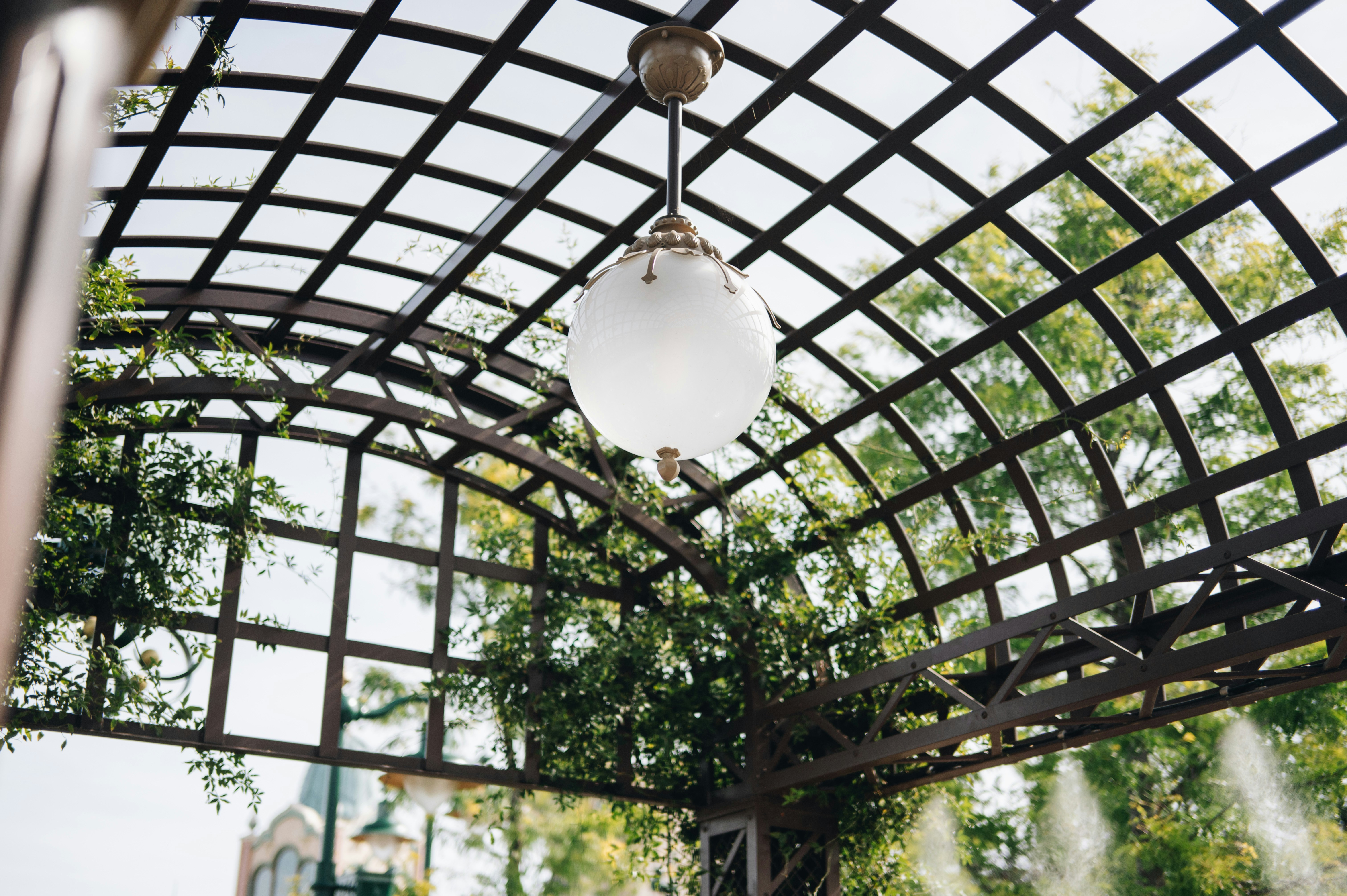 Geometric Lantern: A Roofed Conservatory with Hanging Globe