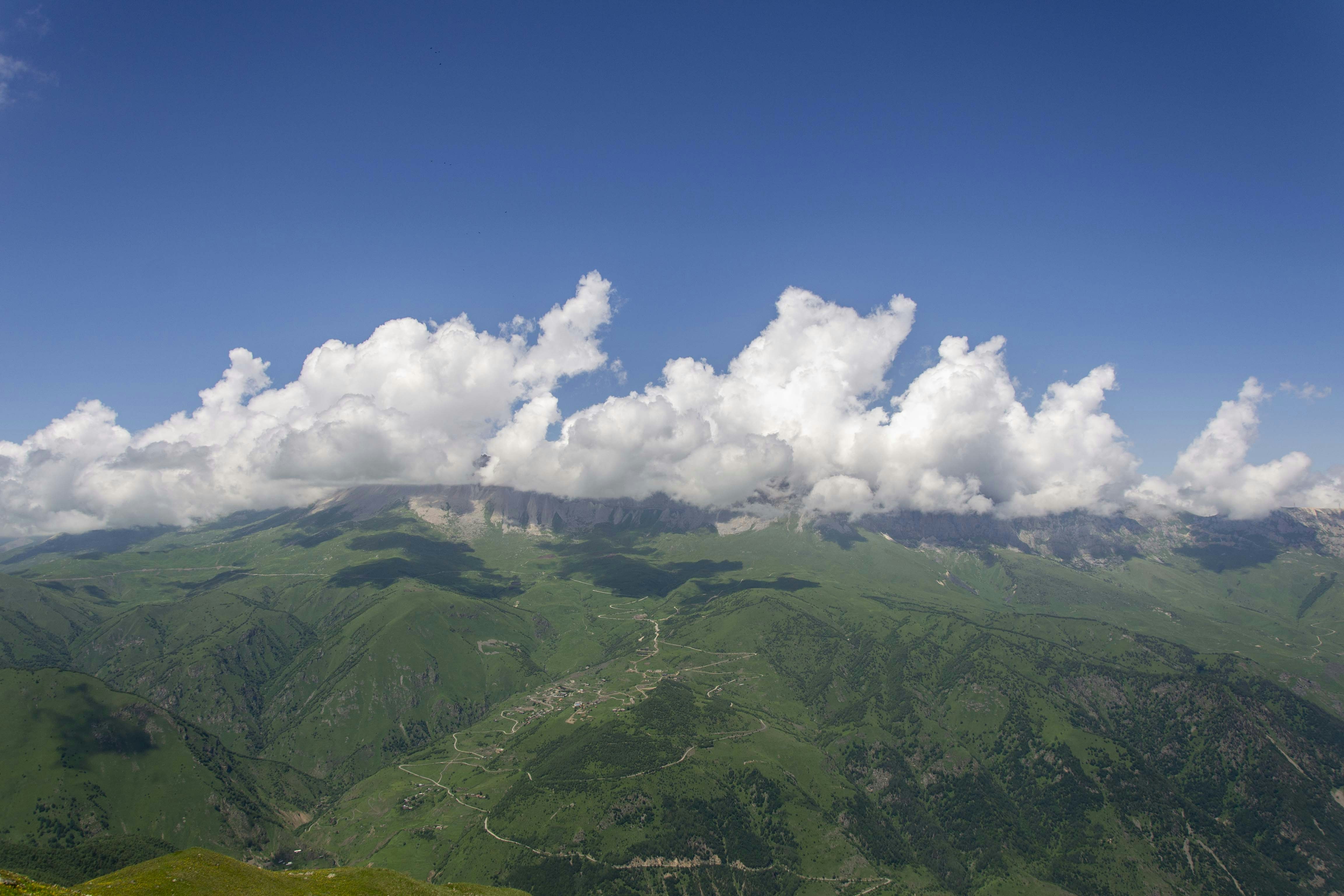 Horizon of Clouds Over Verdant Valleys