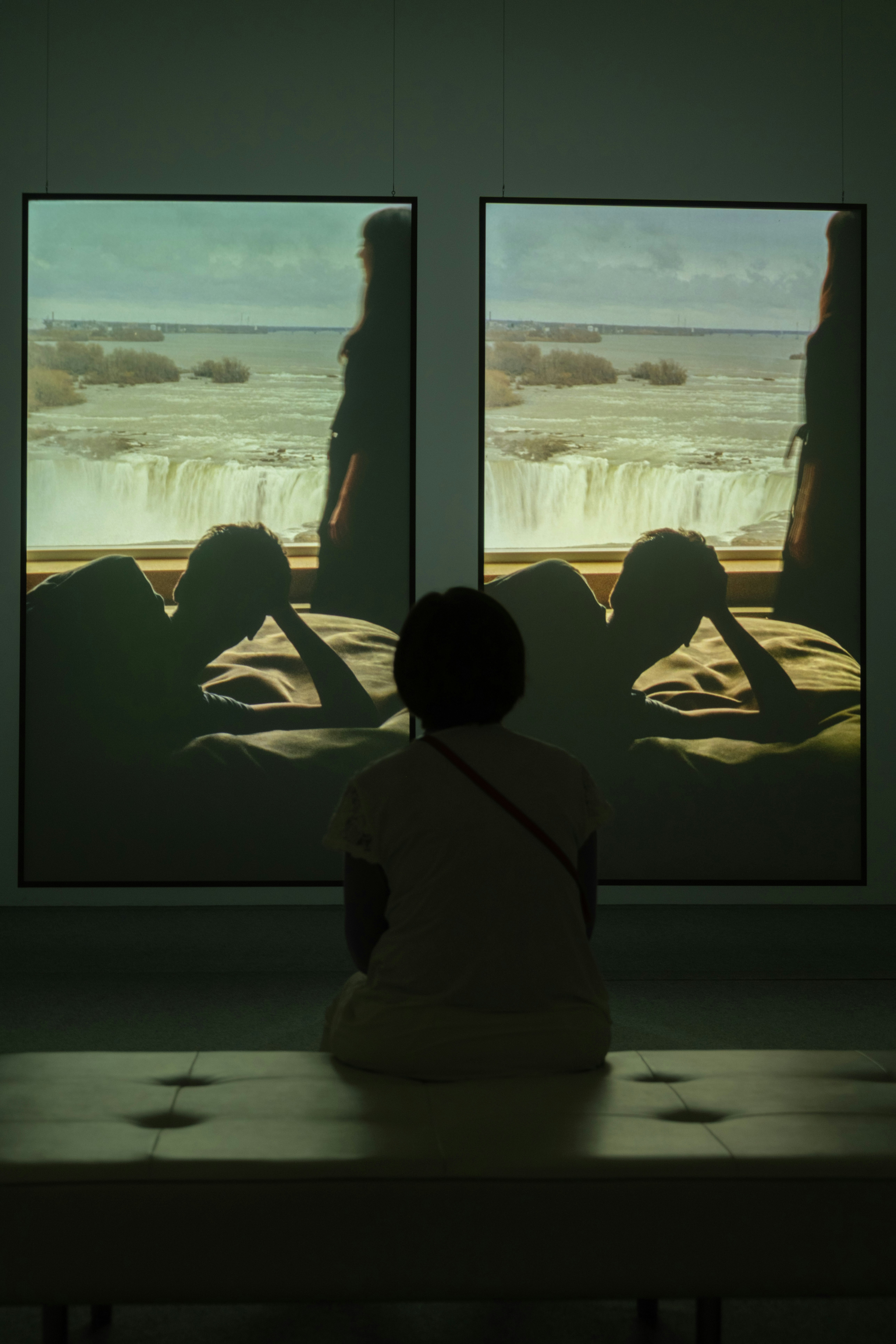  watching the waterfall through a split-screen reflection