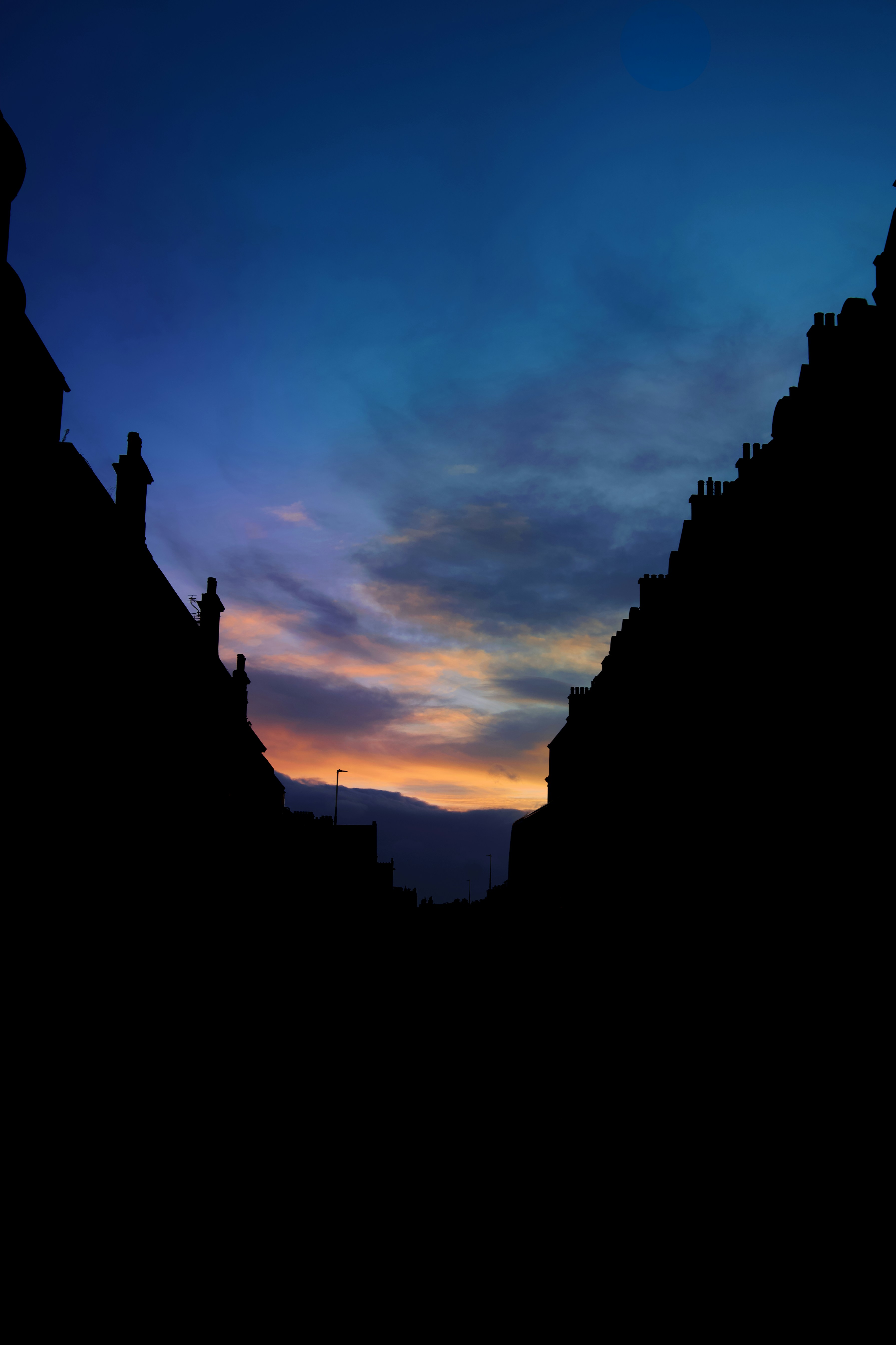 Dusk Between Rooftops: A Skyline Silhouette