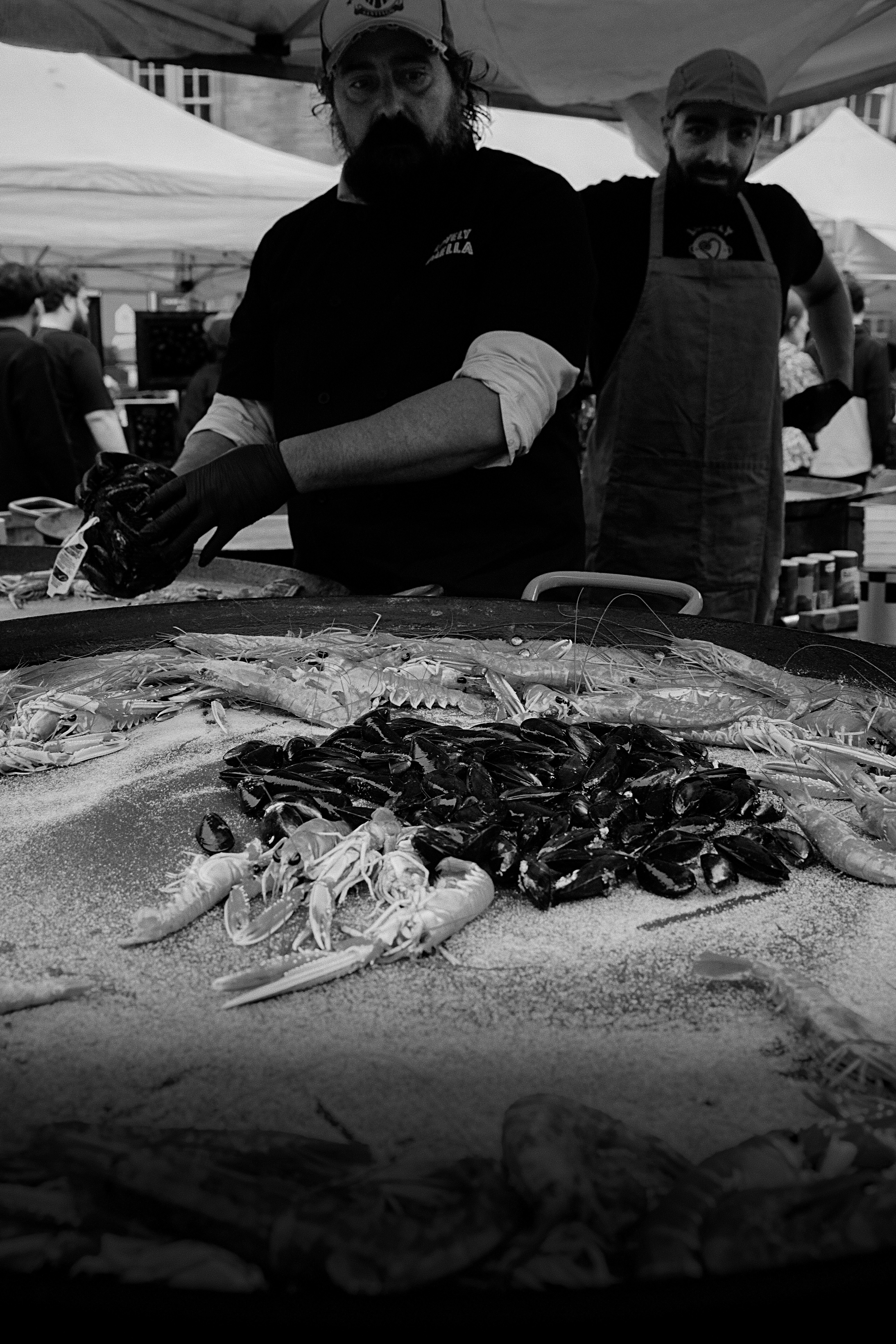 Grill Masters at Work: Seafood Spread Under Market Tents