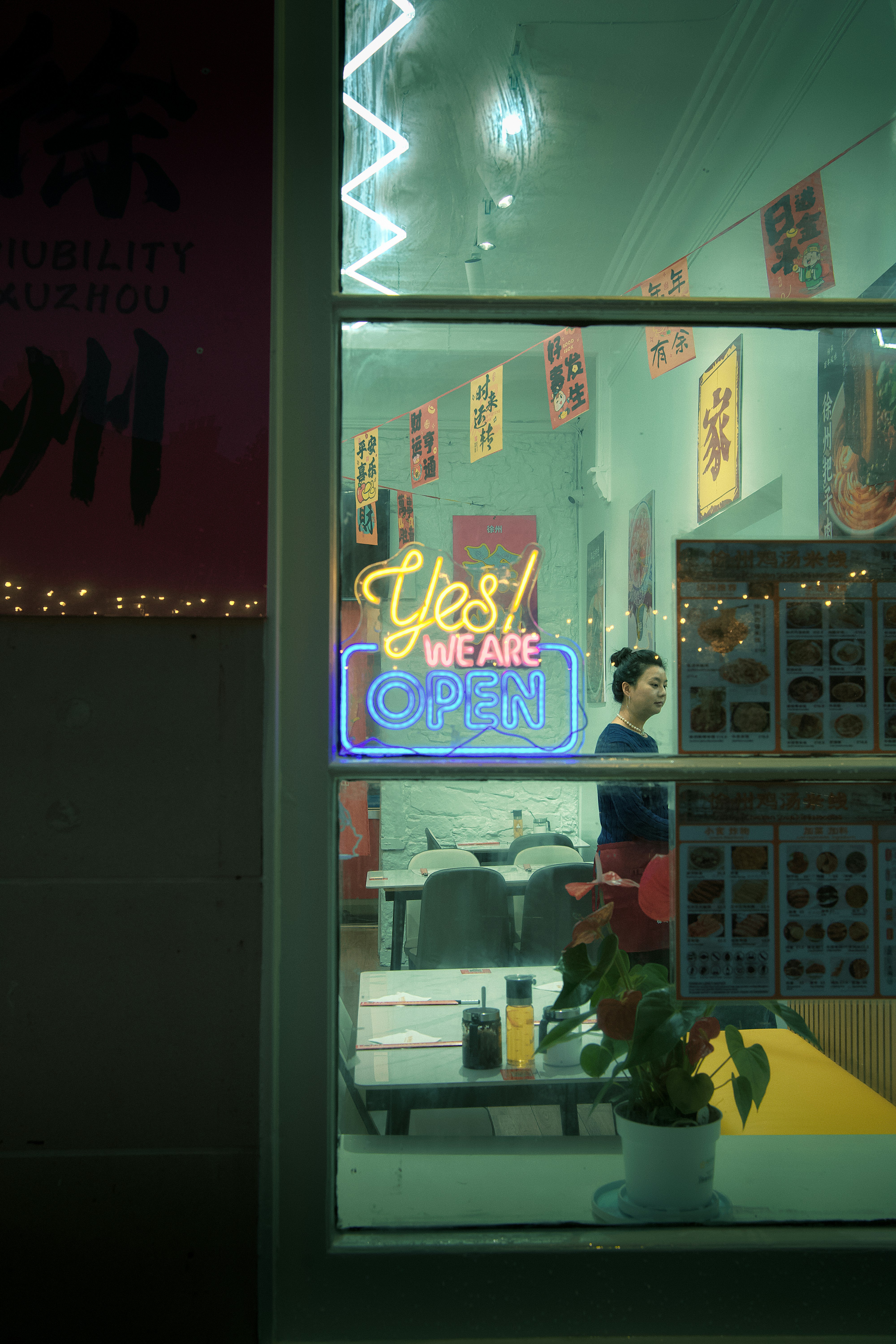 Neon Welcome: A Quiet Moment Inside an Open Sign Shop
