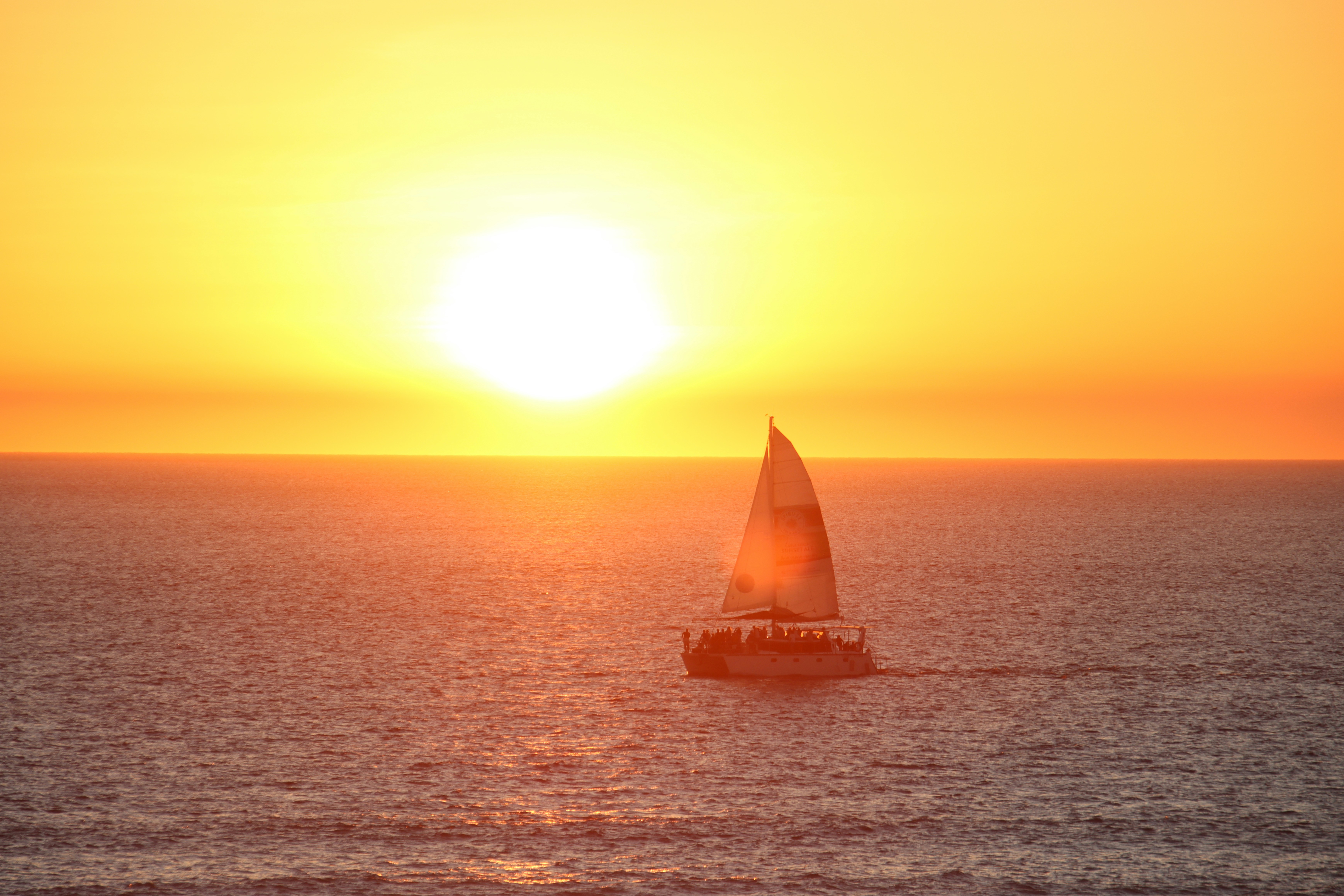 Sailboat at Quiet Horizon under a Citrine Sunset