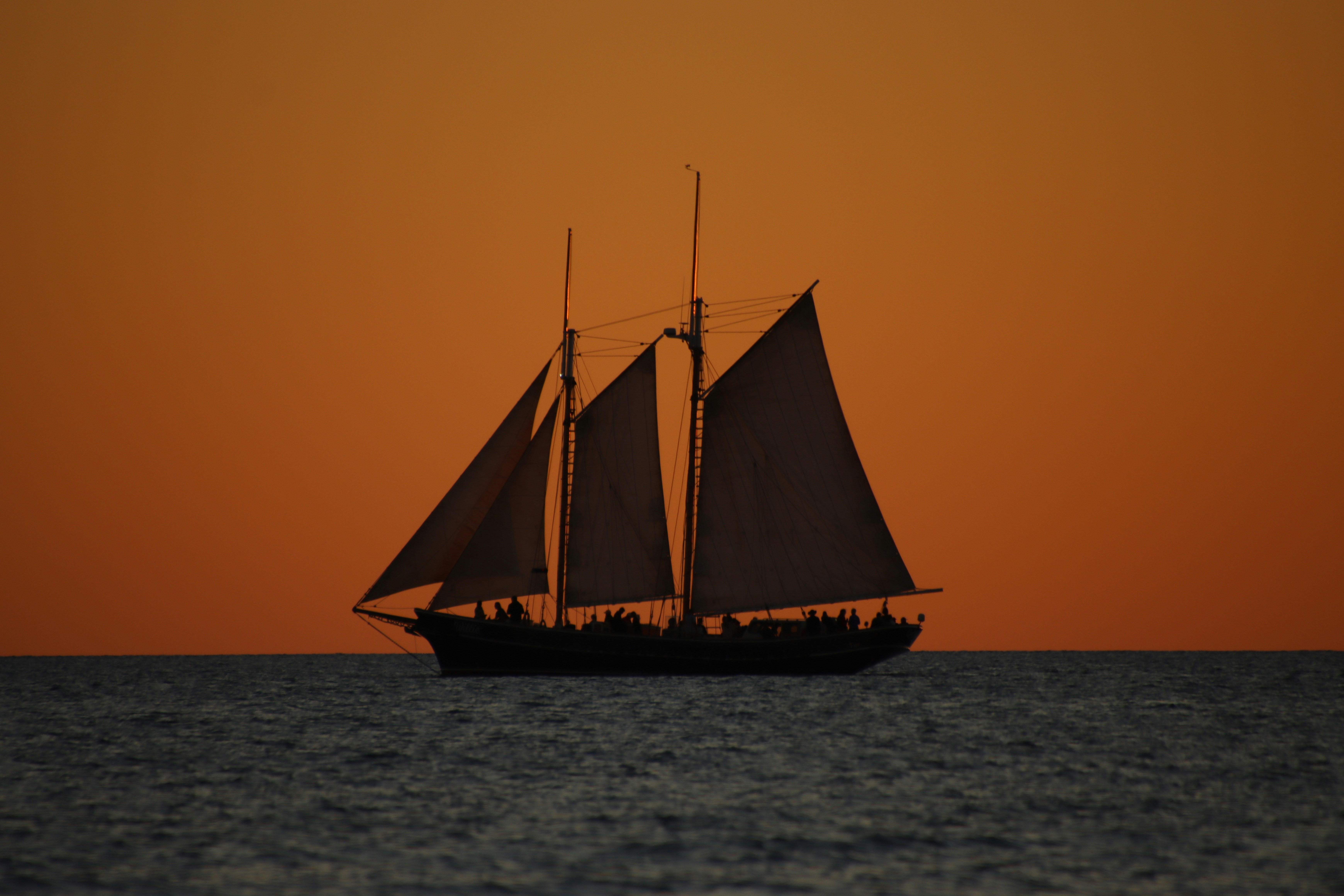 Silhouette beneath the Evening Sails
