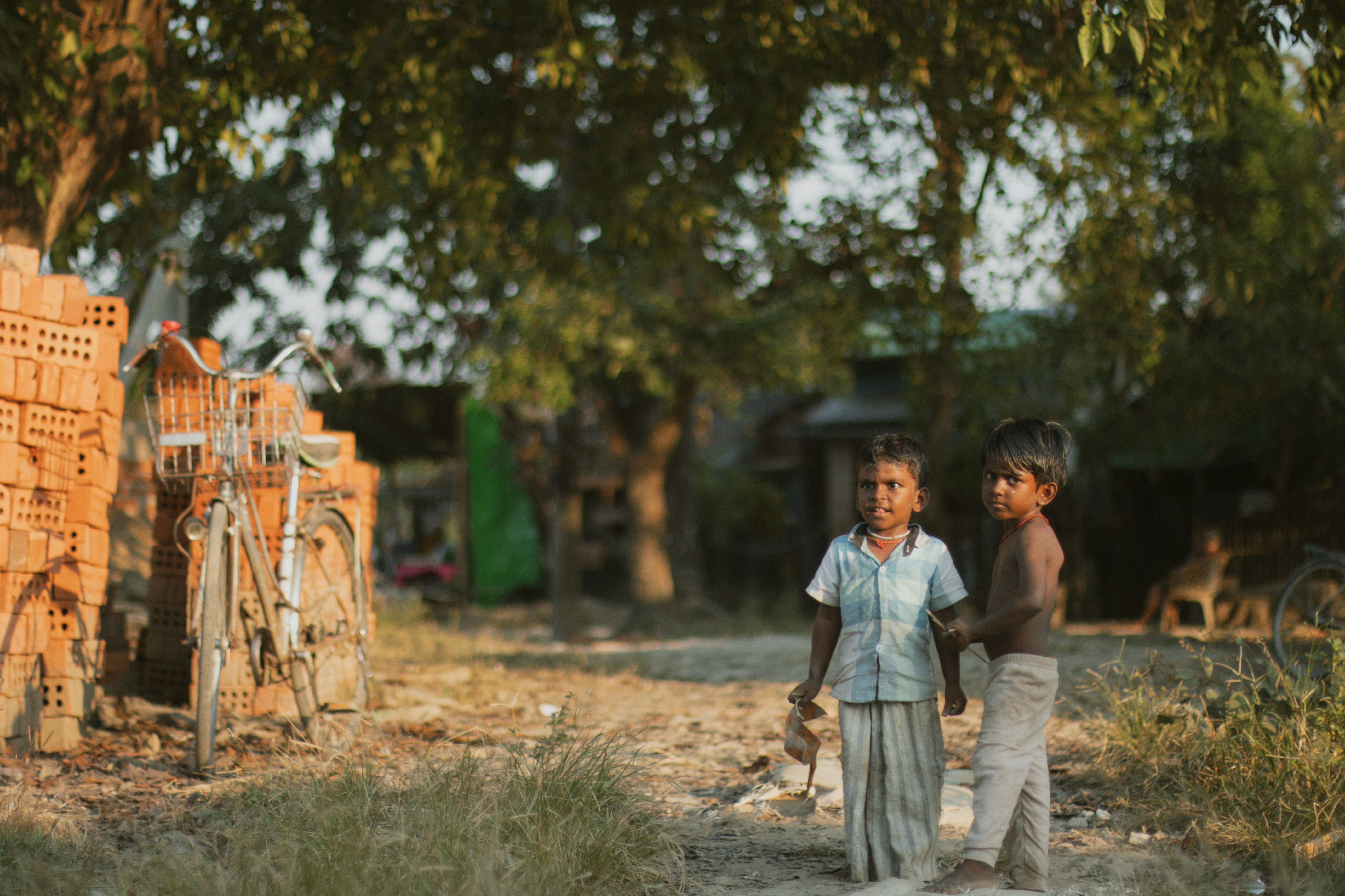 Dusty Village Moment: Two Boys at the Edge of Light