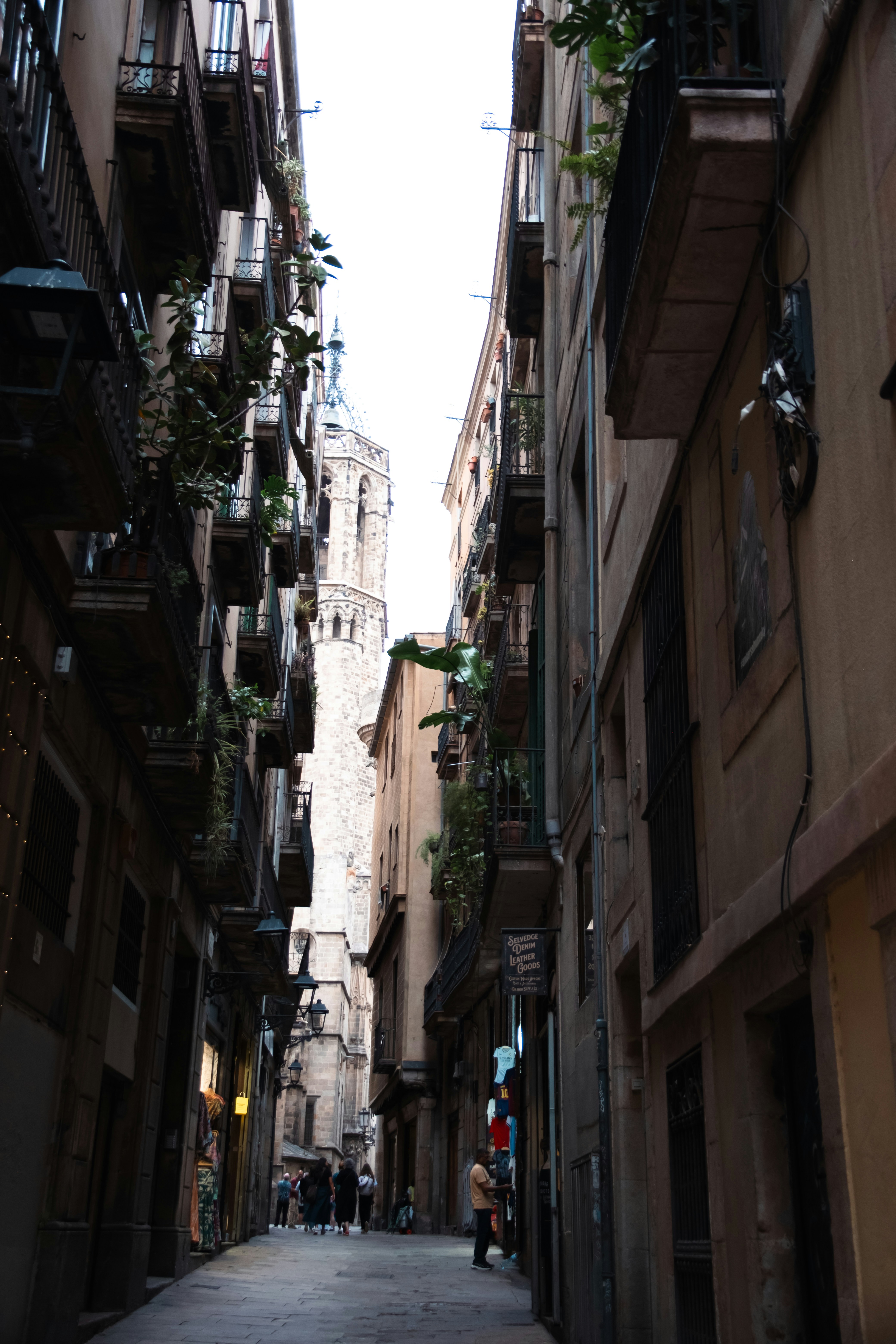 Narrow Catalan Street Converging on a Tower