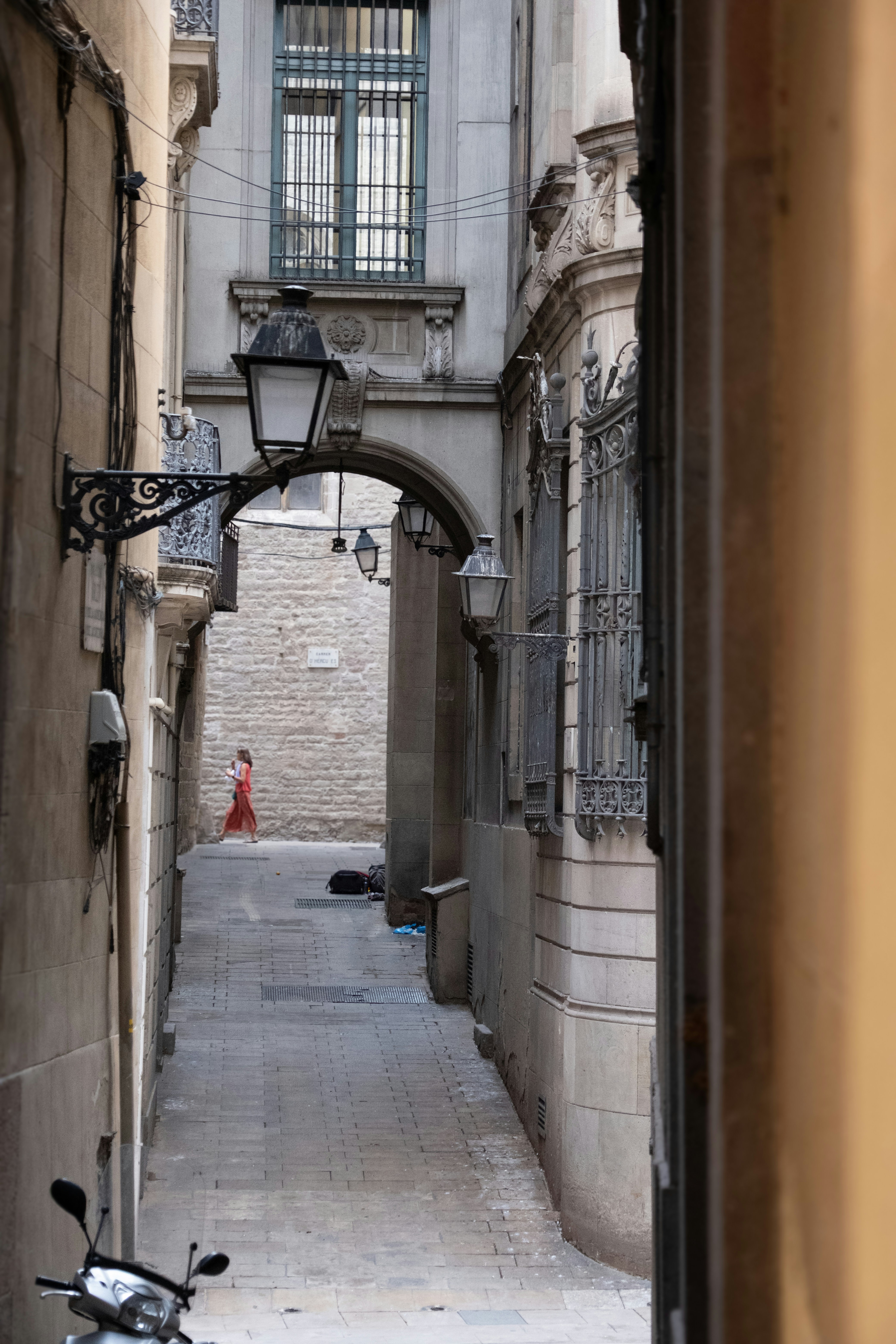 Red-Clad Traveler in a Narrow European Passage