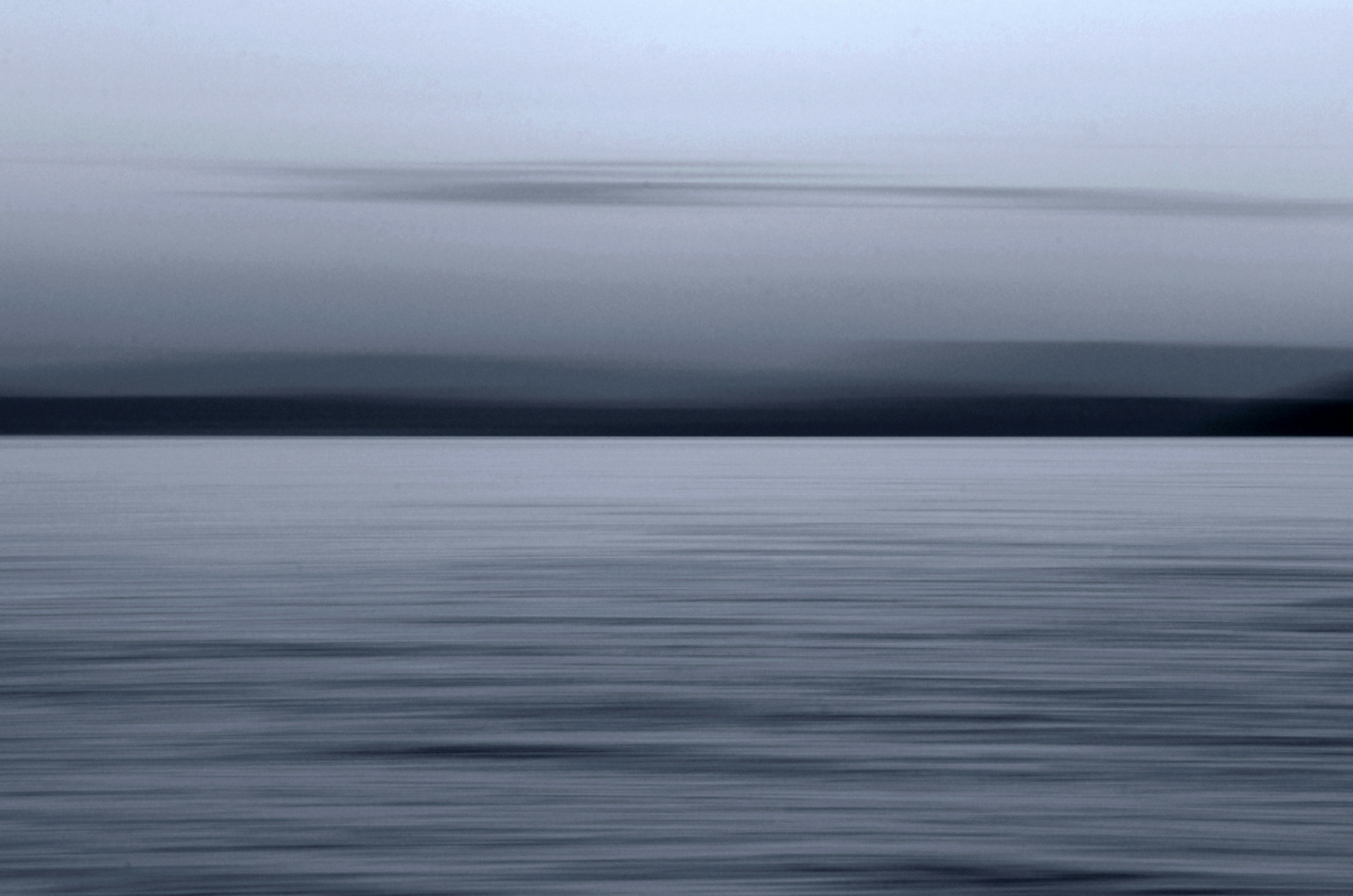 Layers of Quiet: A Stubbed Horizon over Rippling Water