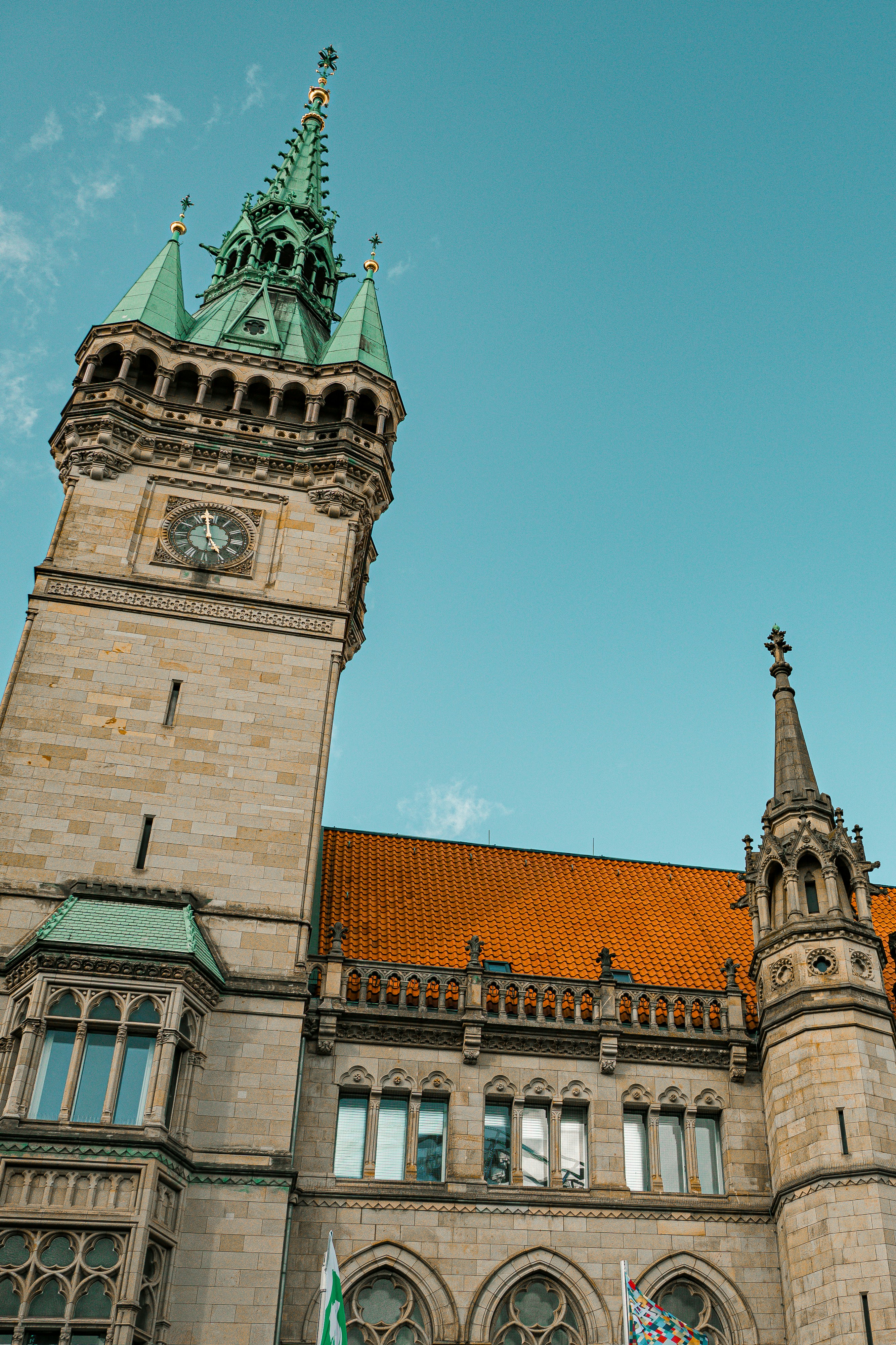 Clock Tower and Turrets Reaching Toward a Clear Sky