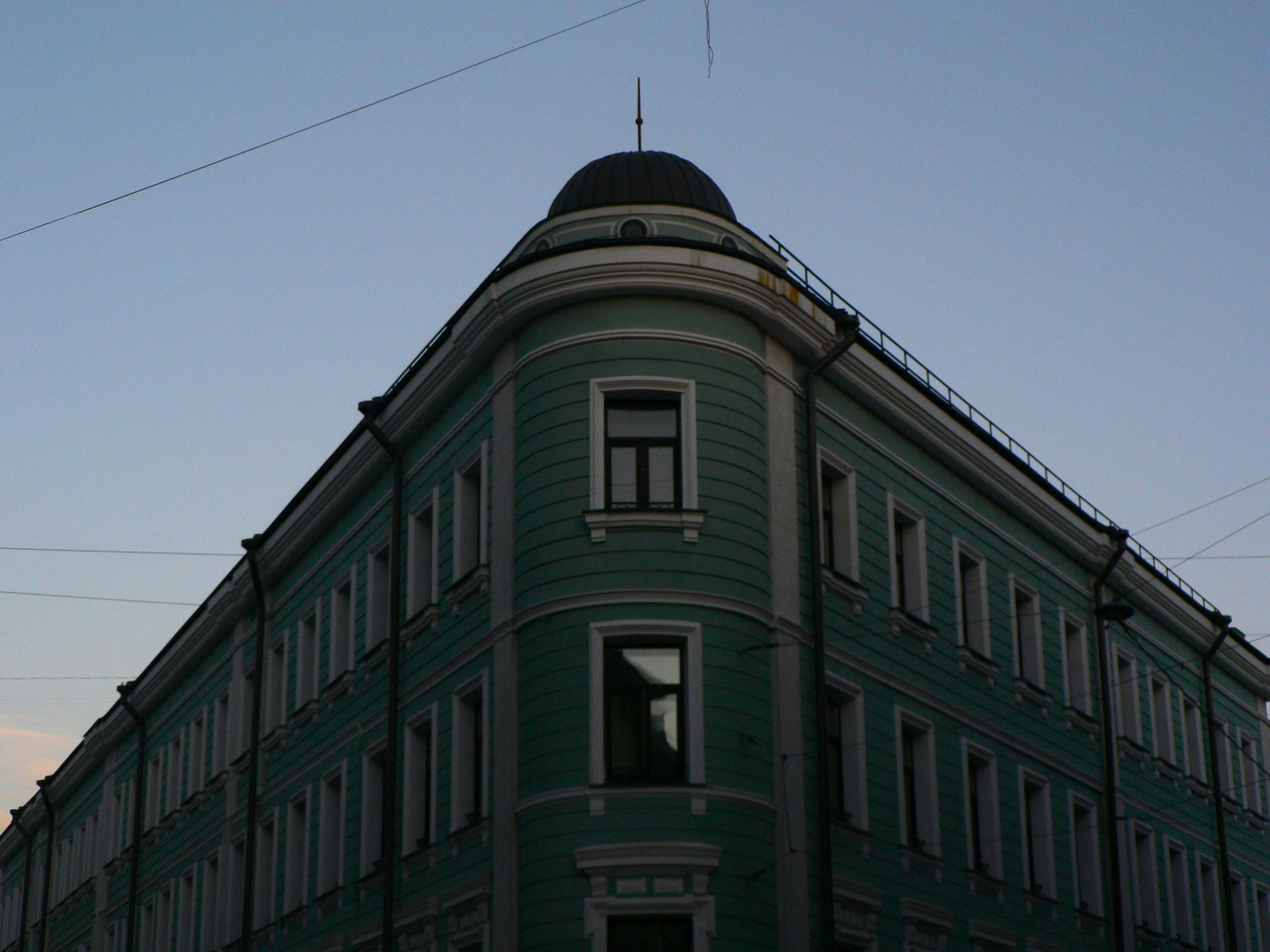 Cornered Grandeur: The Green Facade of a Historic Building