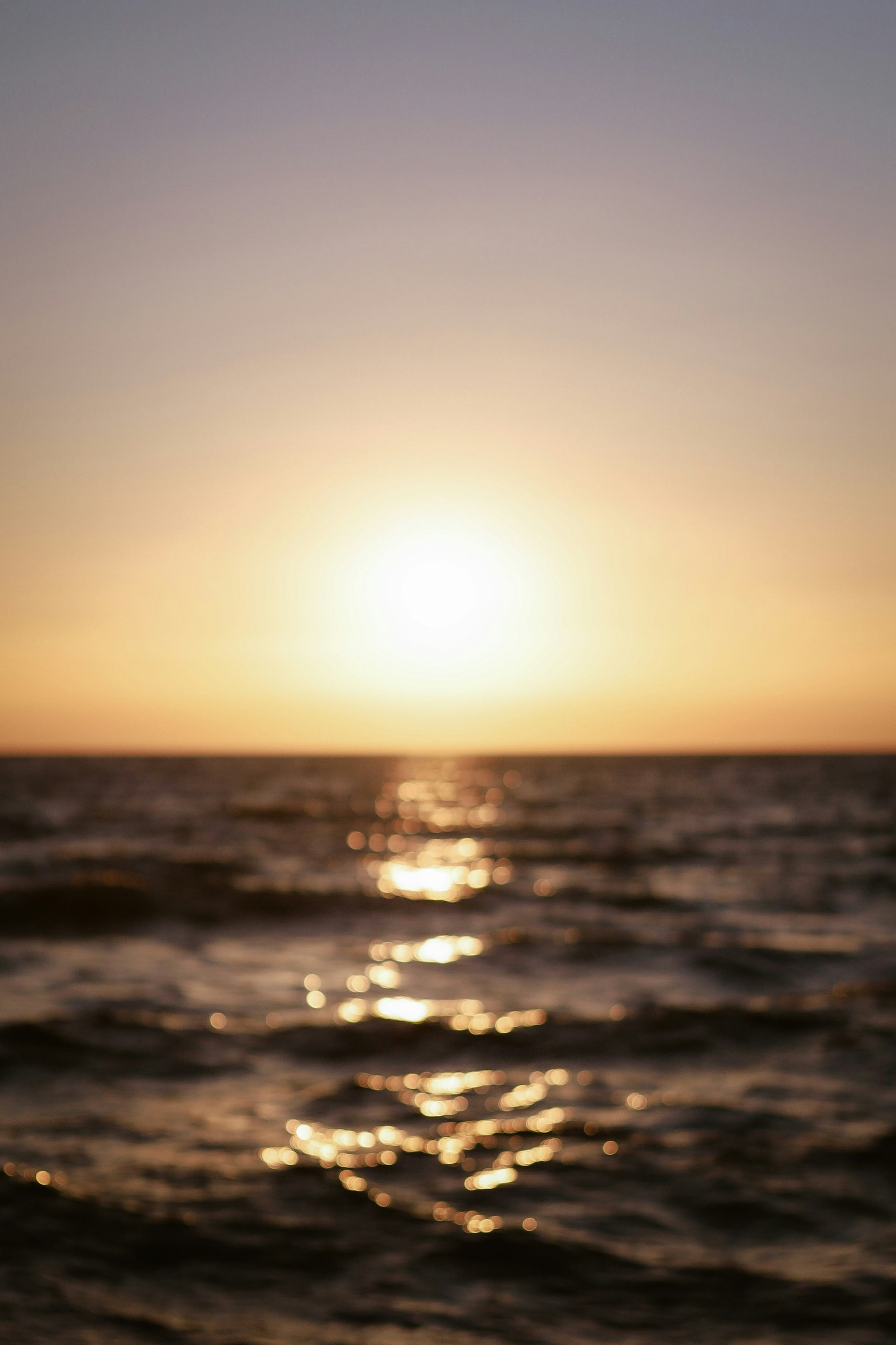Glowing Horizon: Sunset Over Quiet Seas