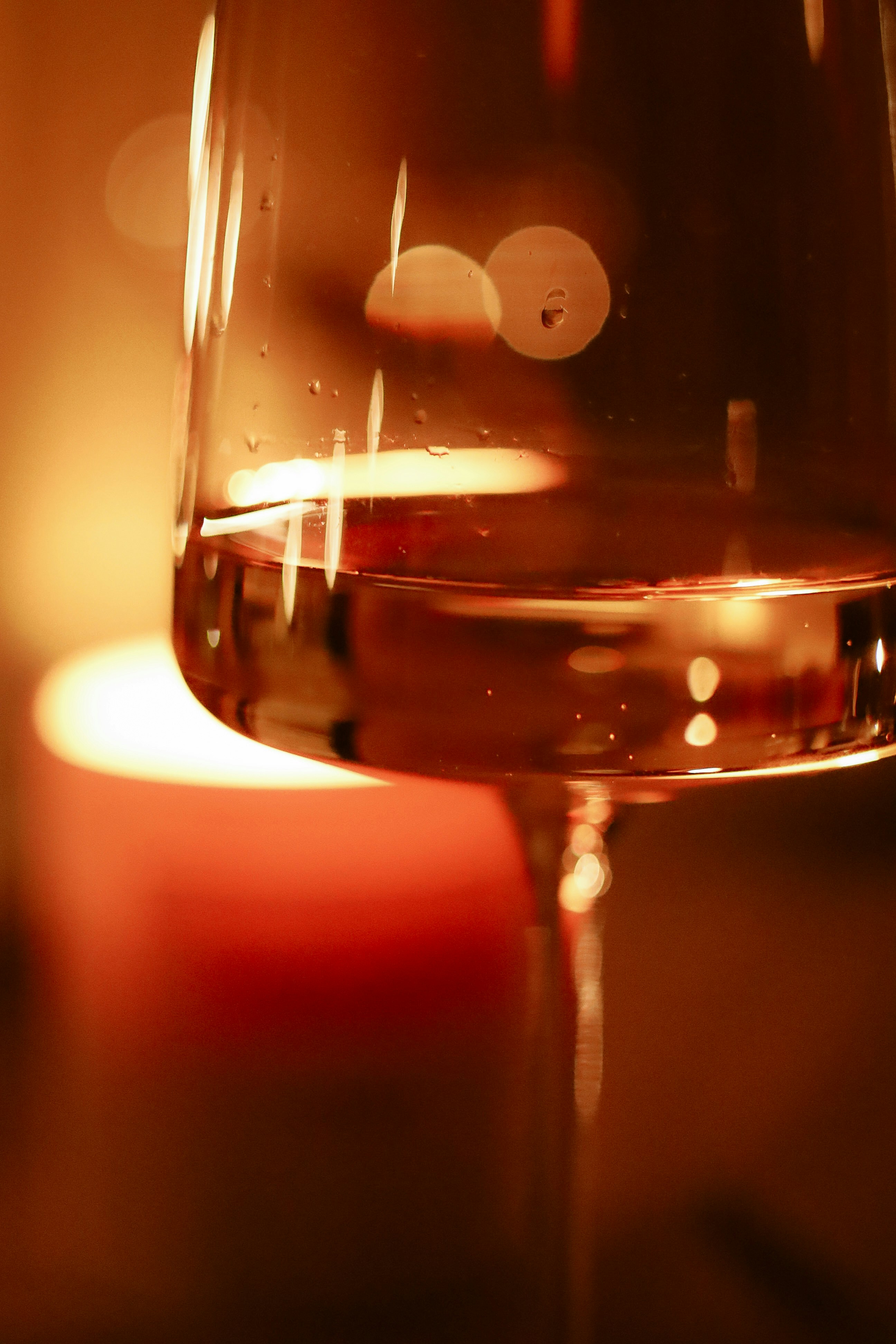 Warm Glow Through a Wine Glass: A Moment of Quiet Ambiance