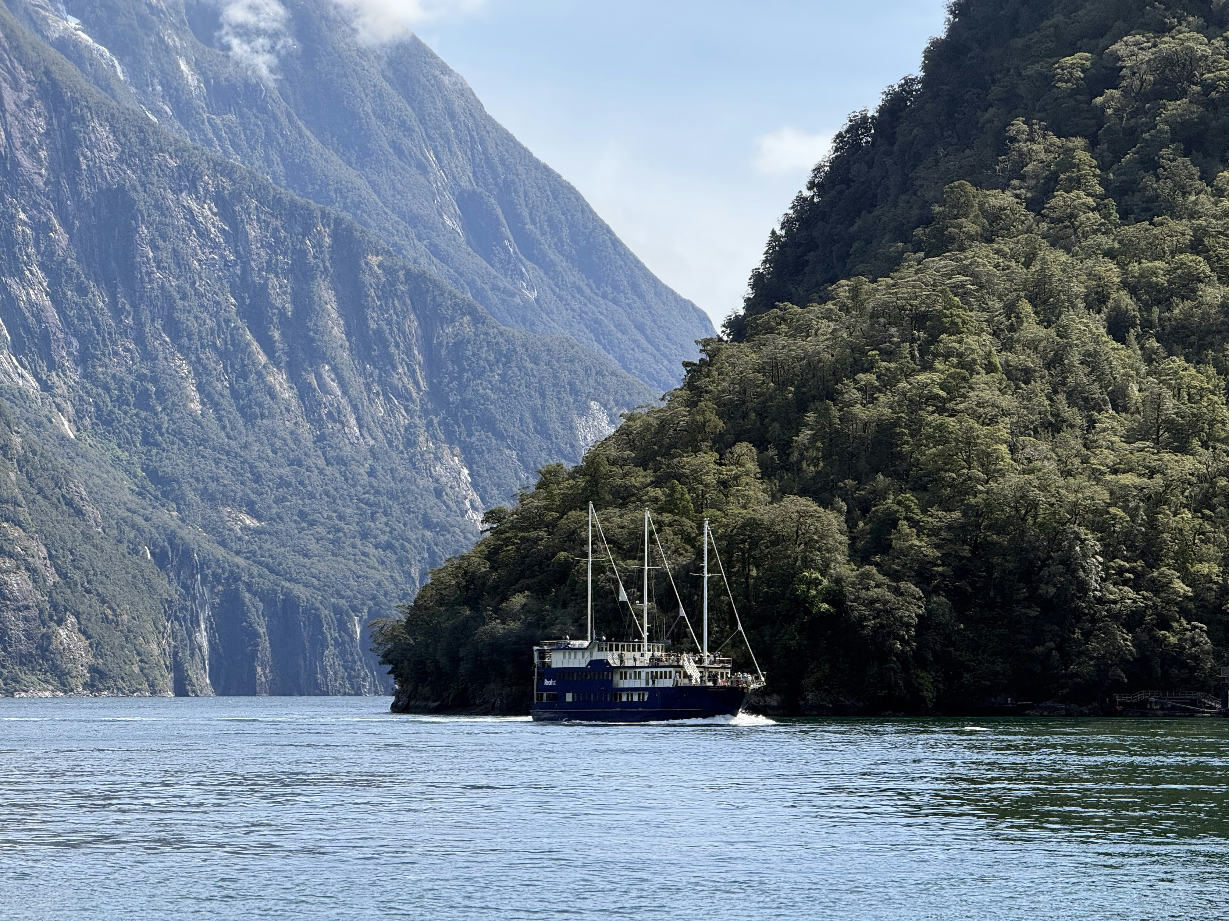 Masted Vessel within a Fjord Gate