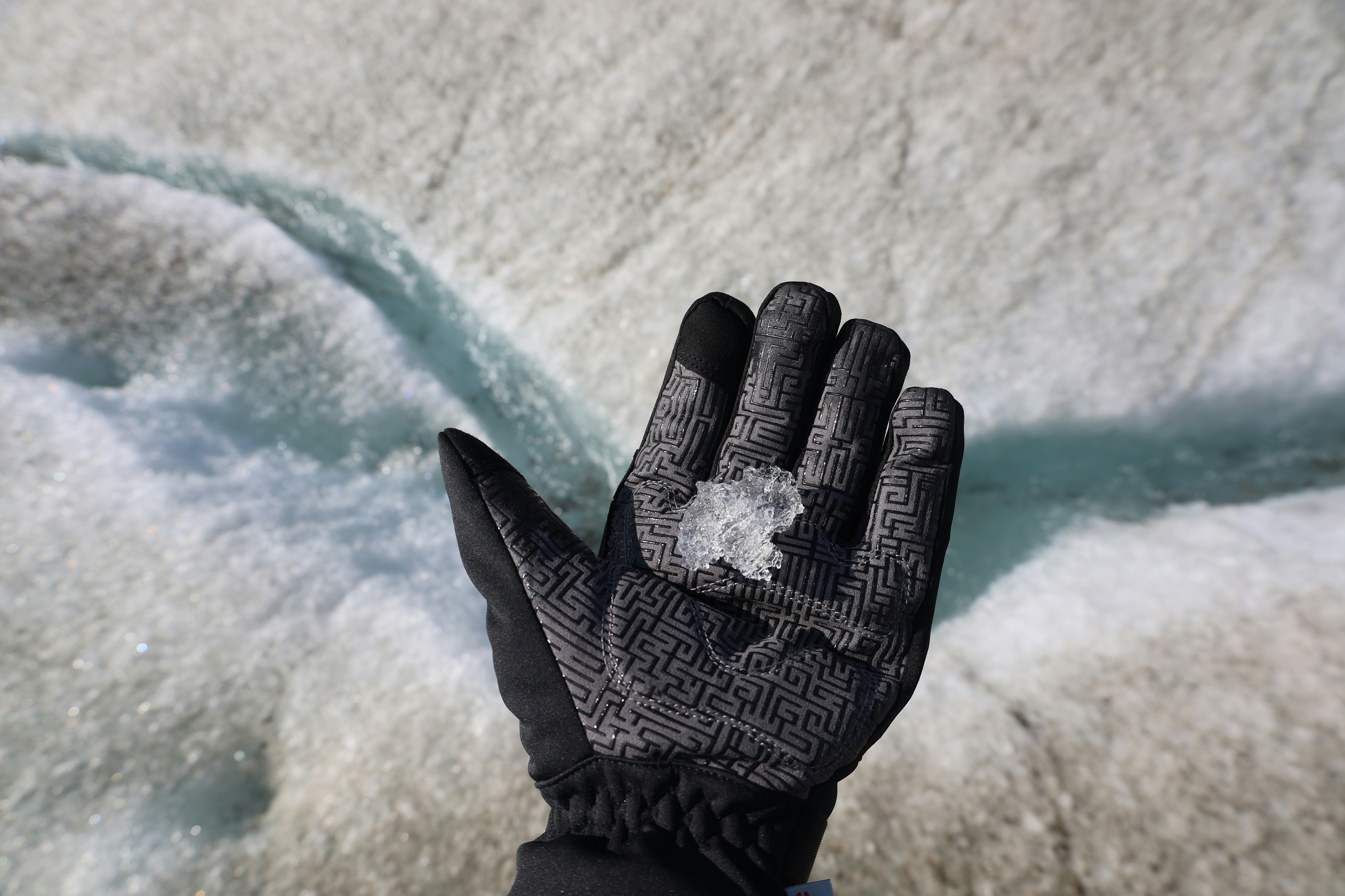 Gloved Hand Over Cold River Ice: Macro Stop-motion Moment
