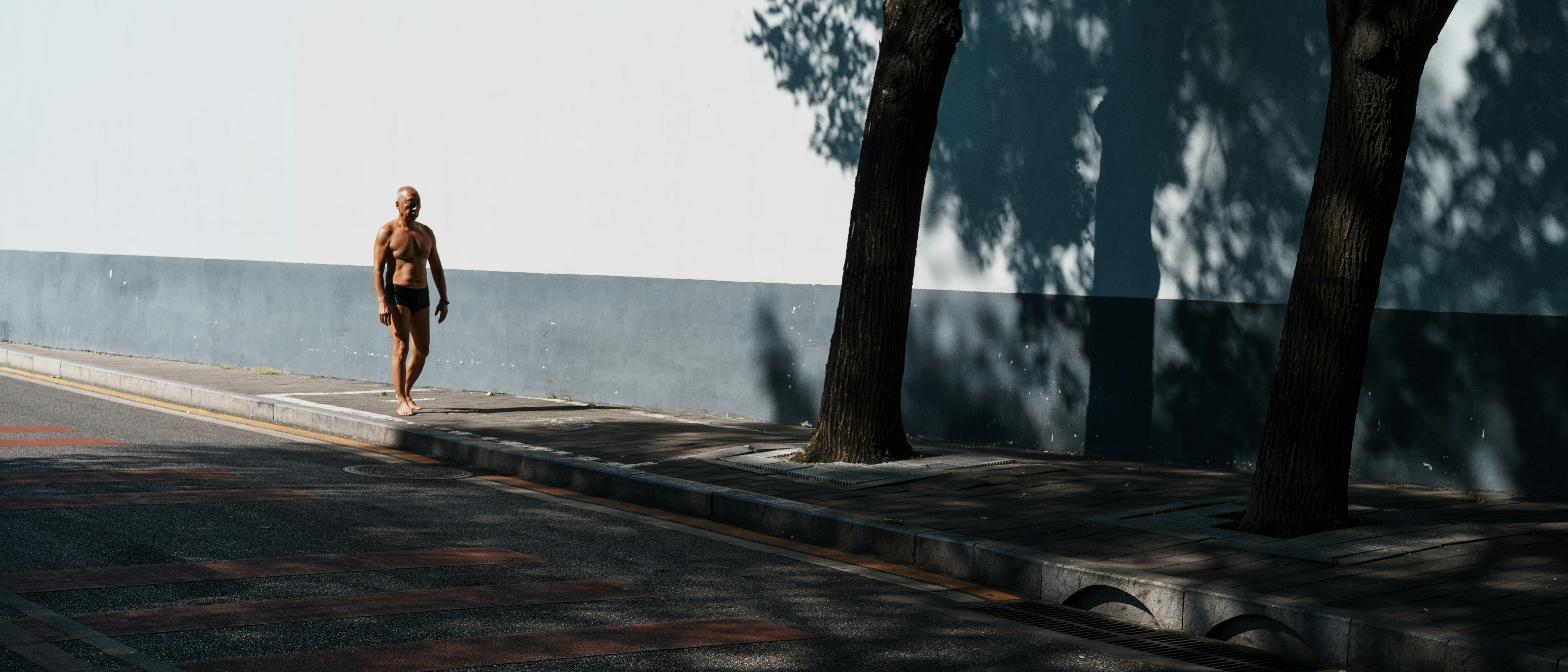 Solitary Stride: A Lone Runner Along a Quiet Riverside Walk