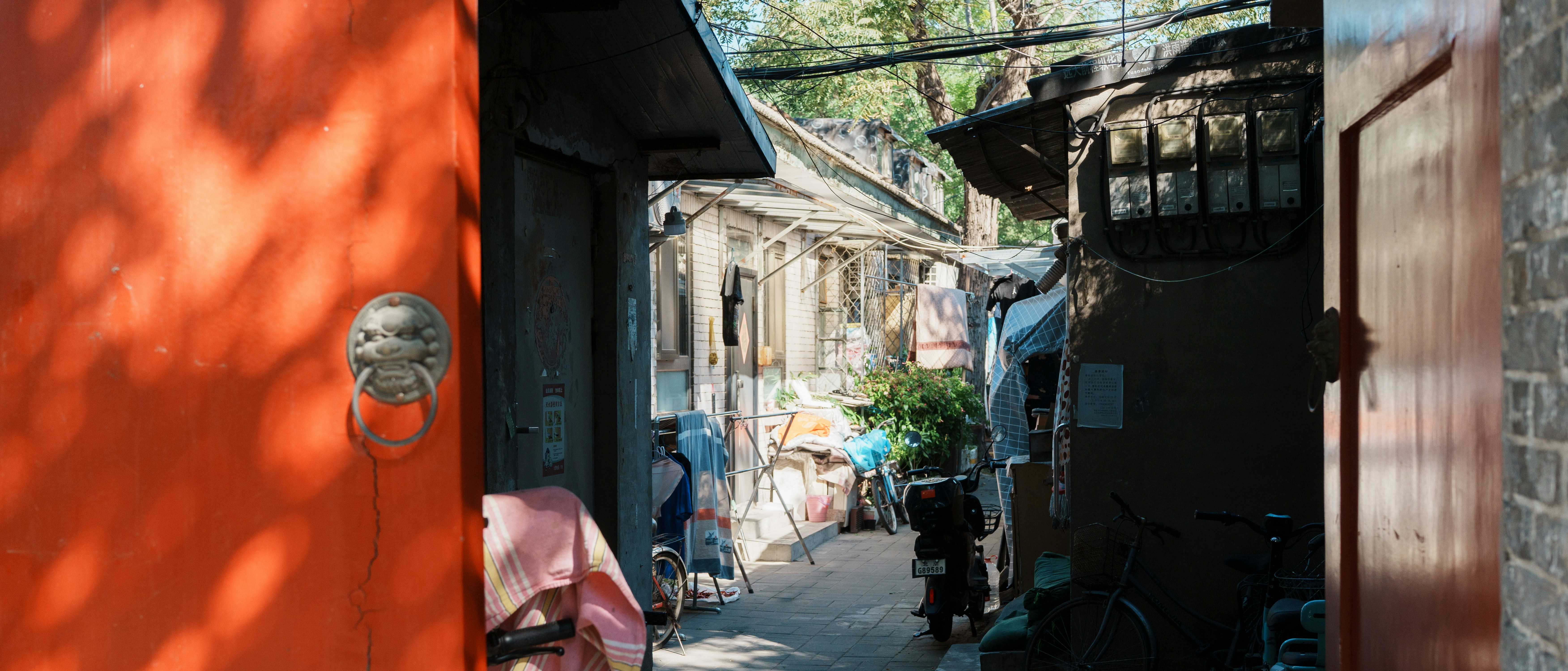 Sunlit Alleyway Between Colorful Walls
