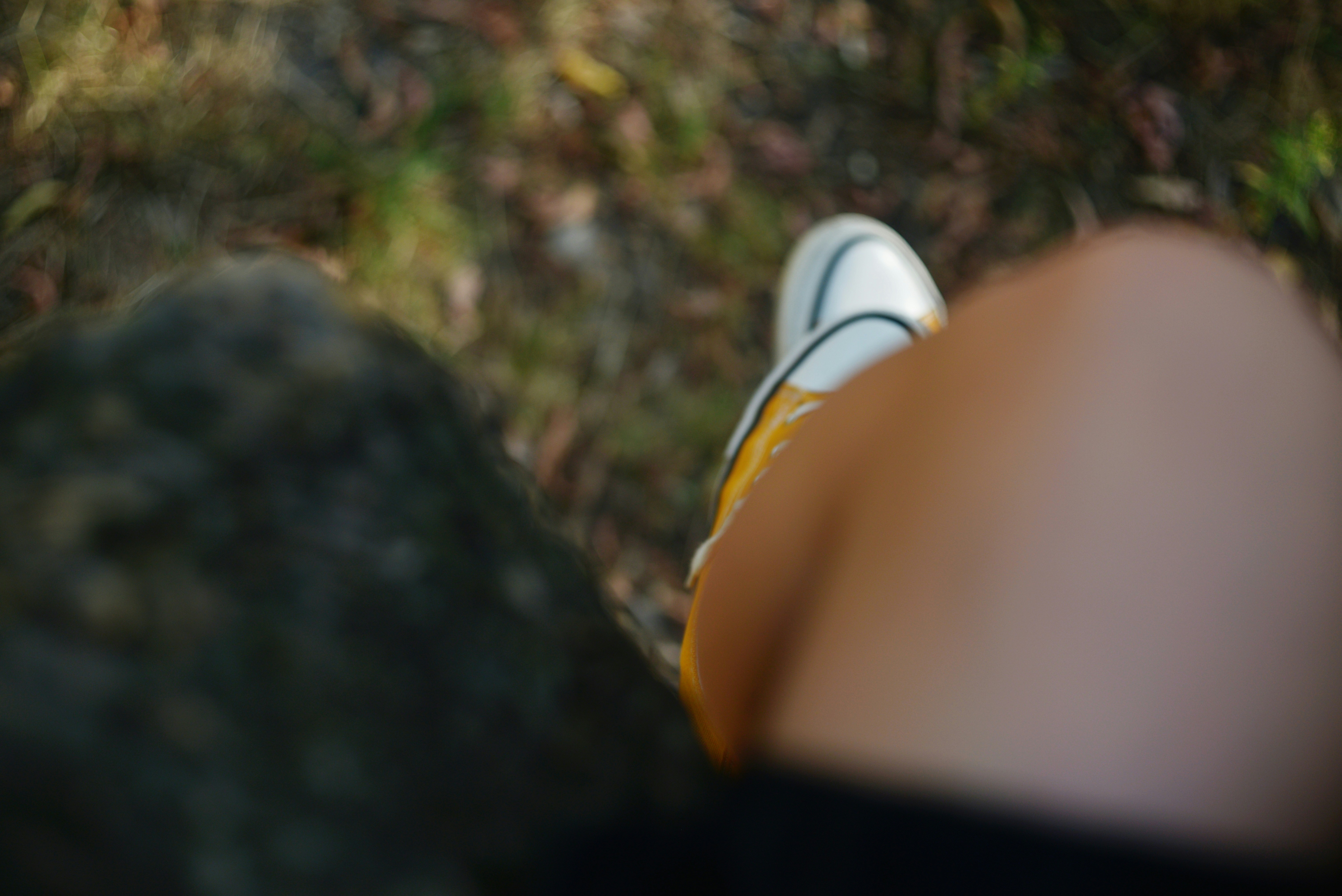A Foot in Focus: A Casual Tilt into Colorful Sneakers