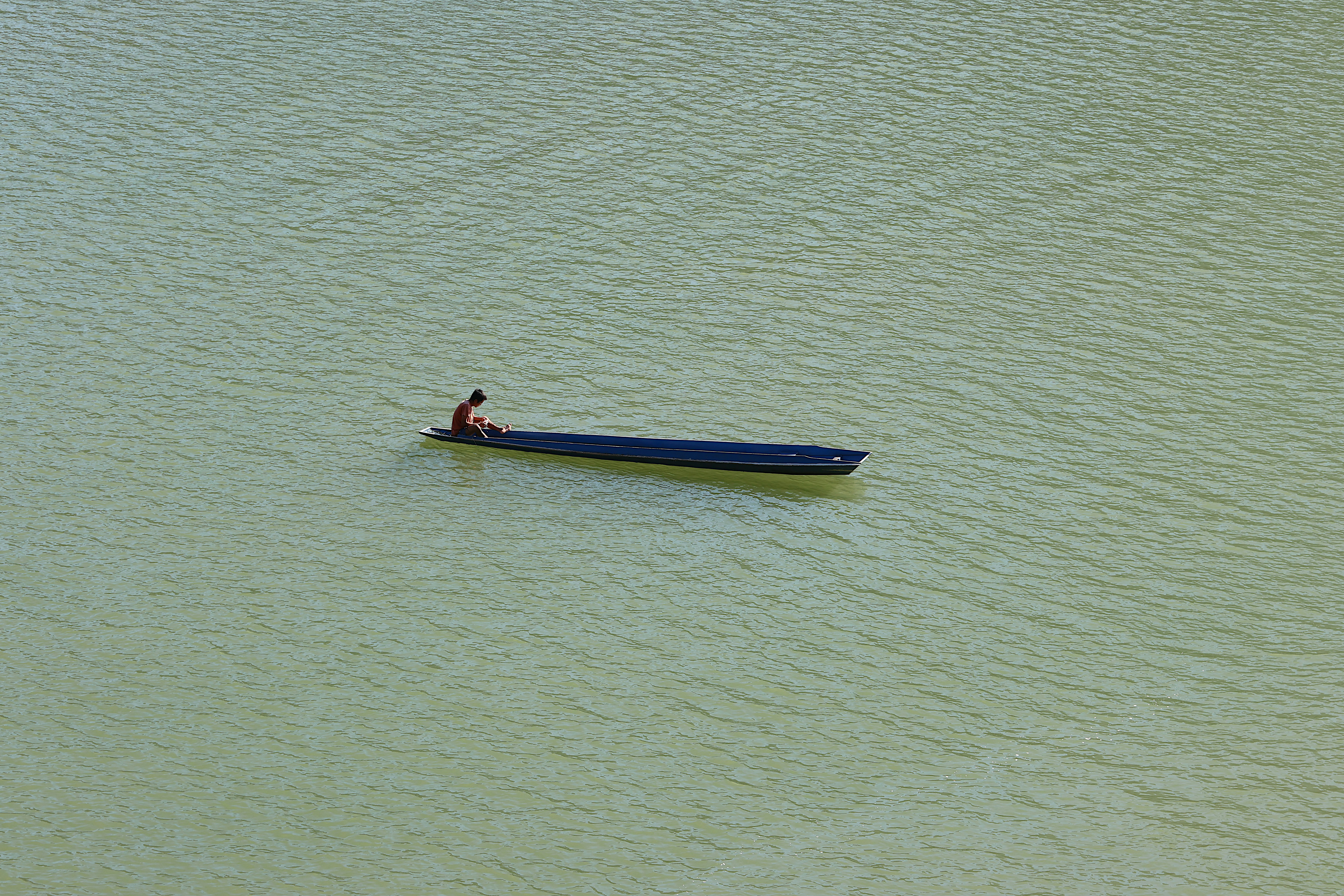 Single Boat on Calm Turquoise Waters