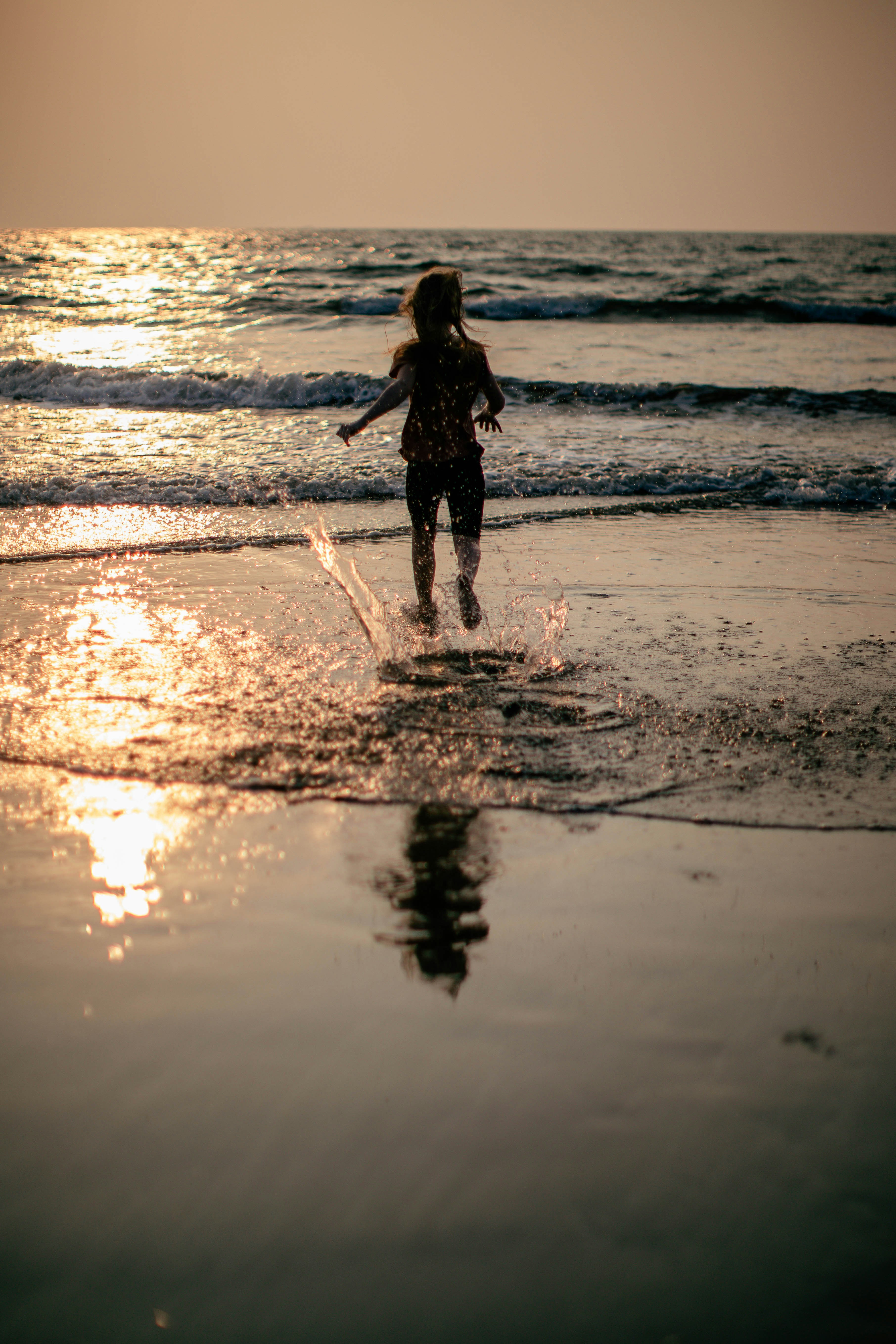 Silent Splash: a child’s leap at the golden shoreline
