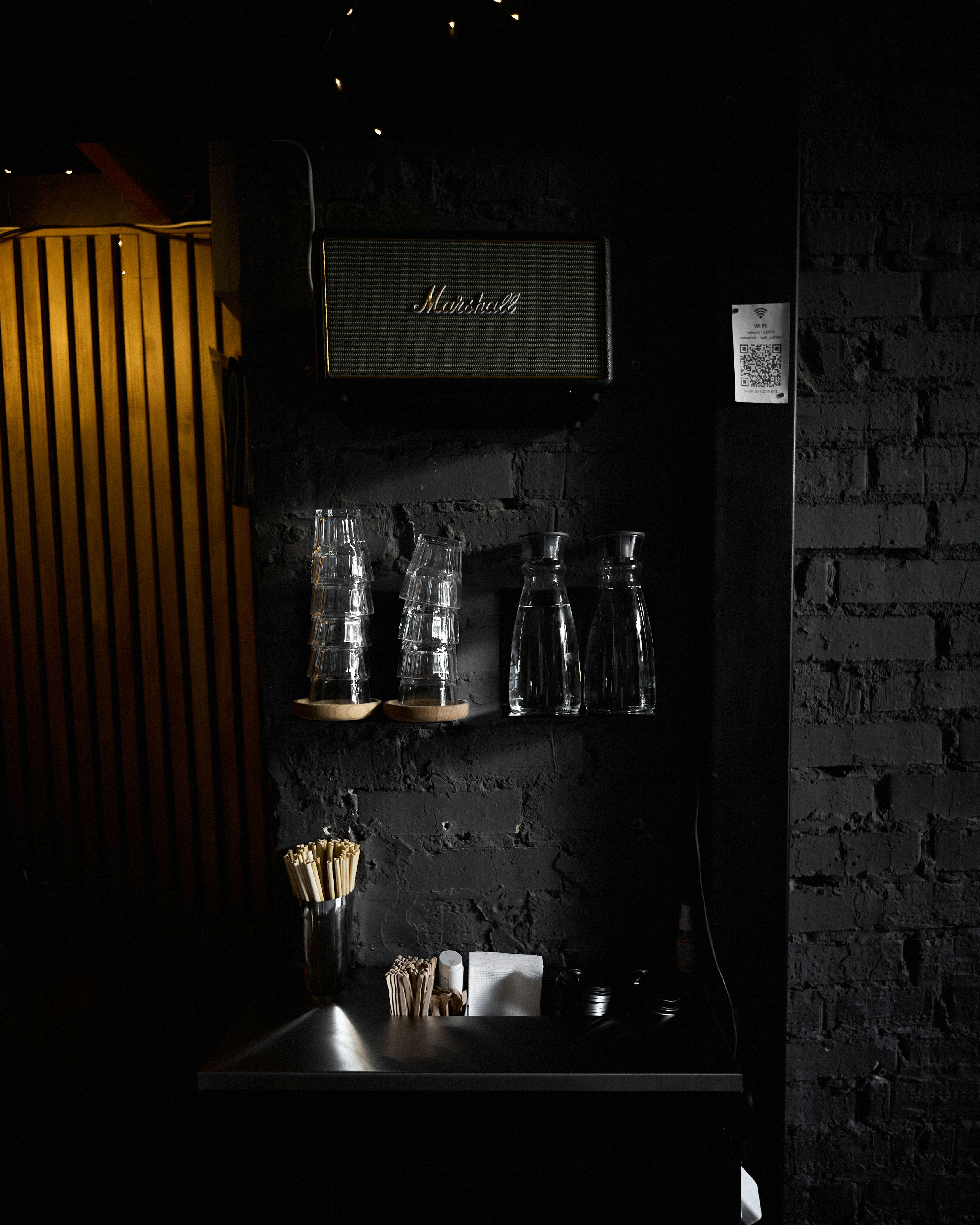 Night at the Bar: Glassware Silence Under a Marshall Glow