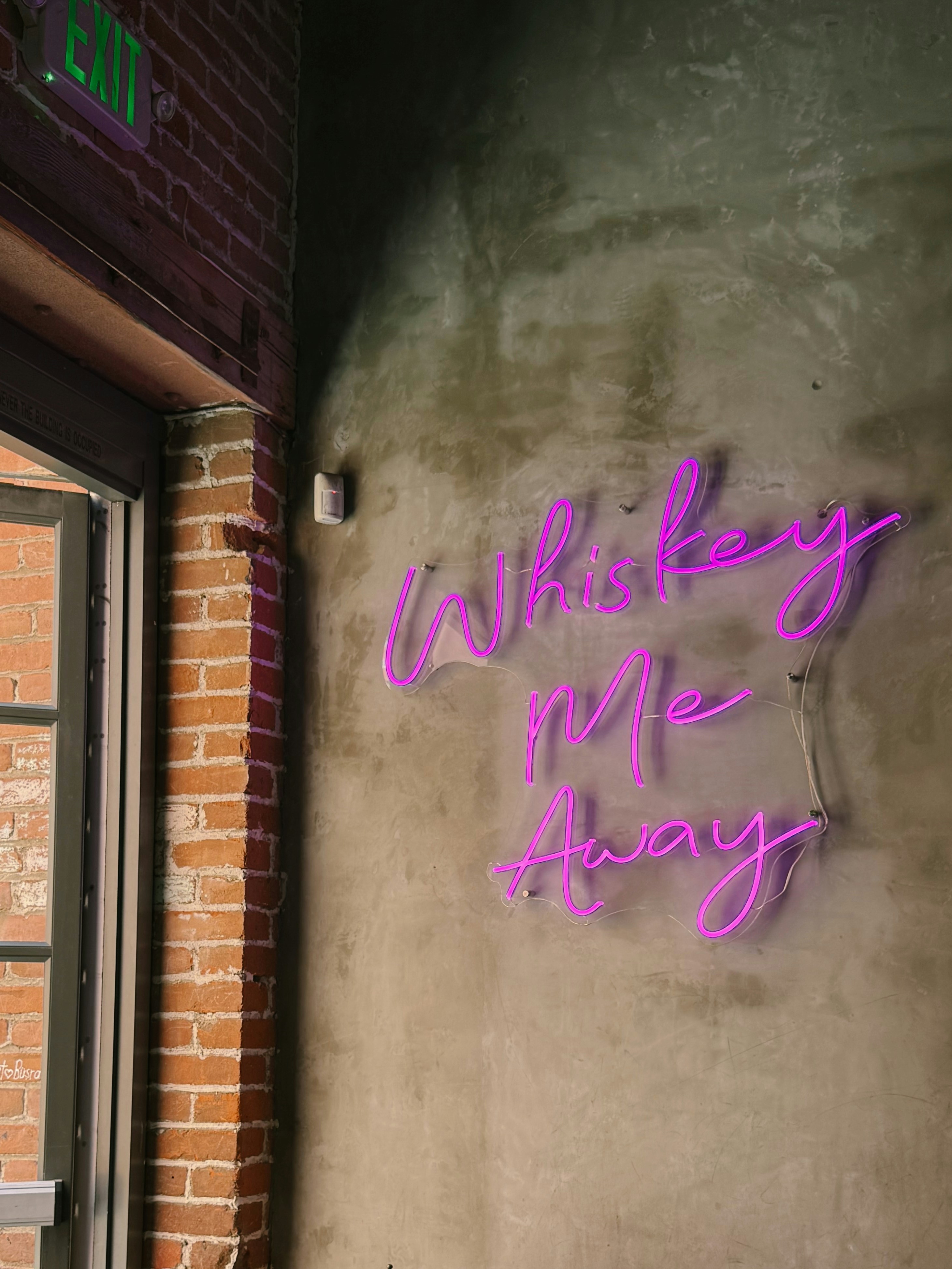 Neon Script on Concrete: Whiskey Me Away