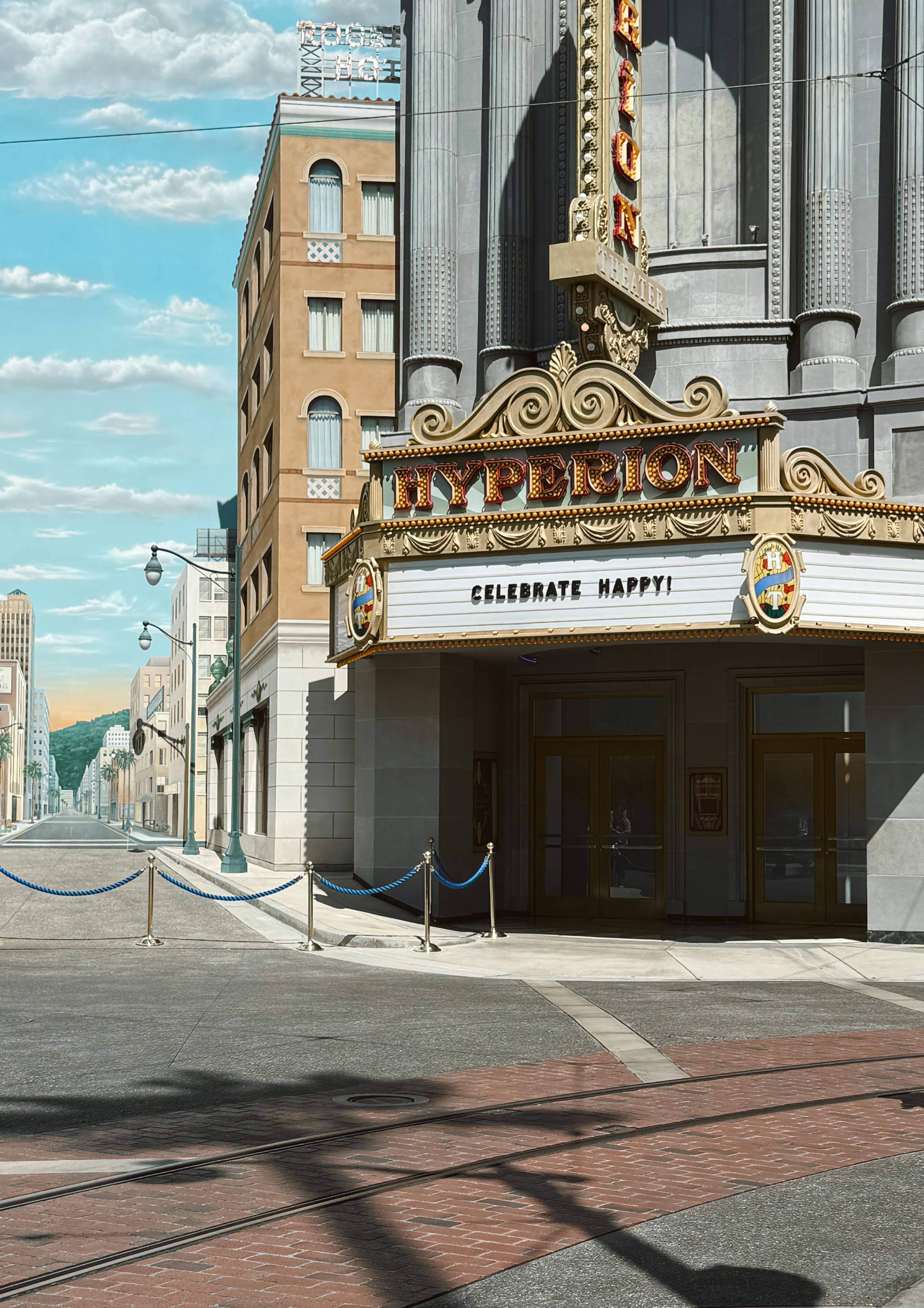 The ornate Hyperion theater marquee dominates the frame, with a sunlit street and surrounding buildings receding into the distance.