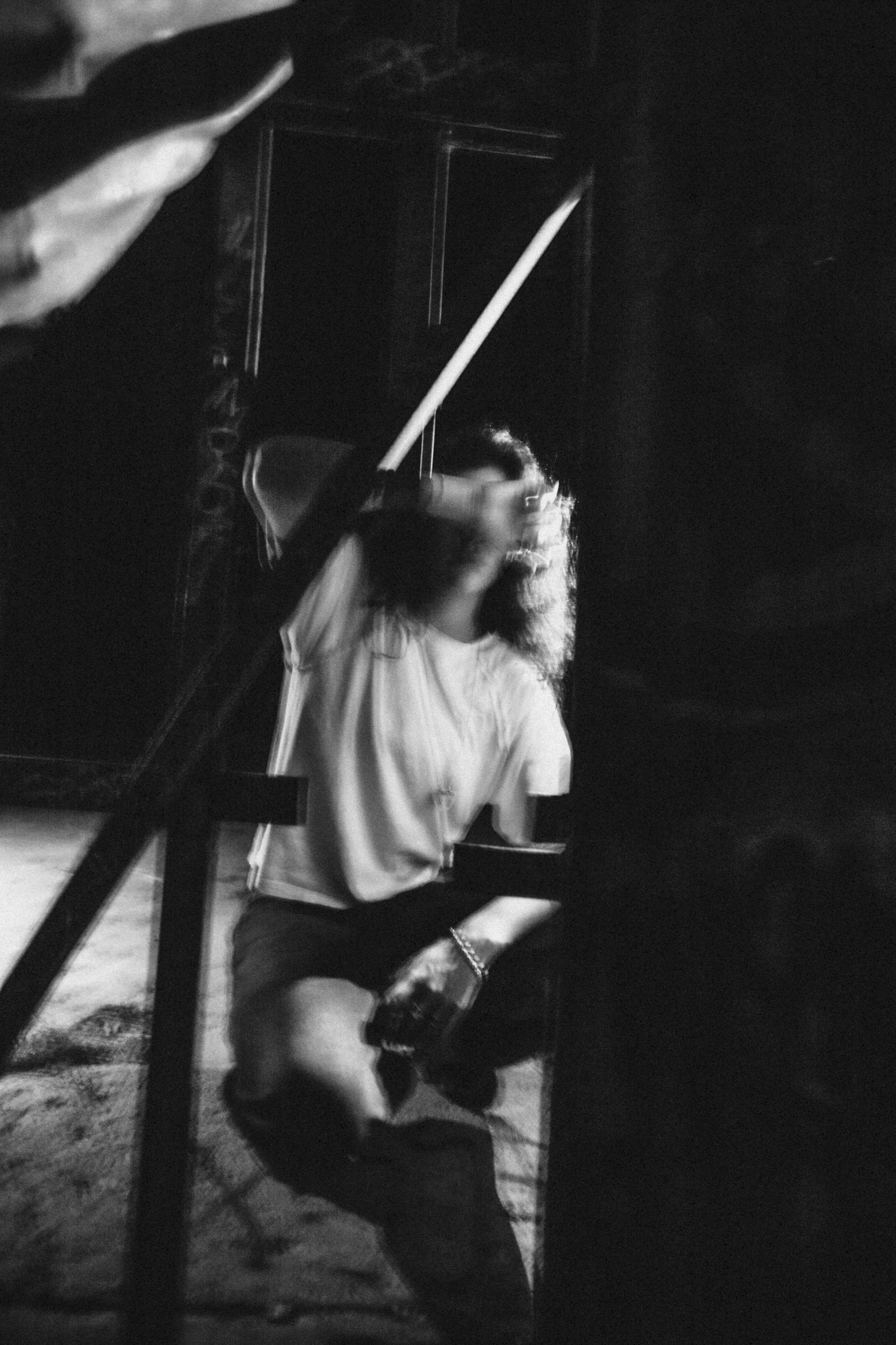Mid-Scene Tension: A Figure in a Dim Stage