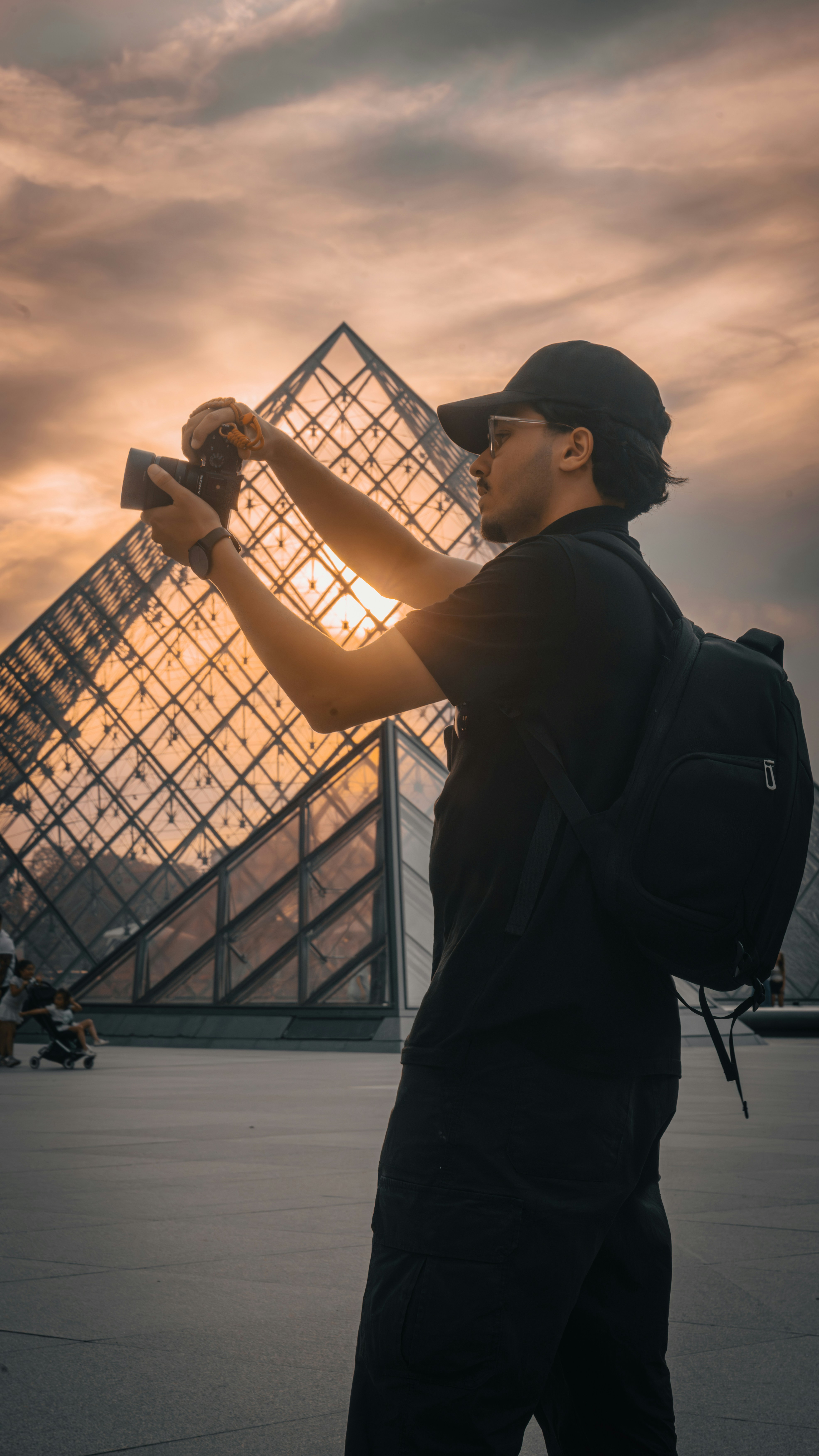 Sunset Frames: A Photographer Capturing the Pyramid Glass at Dusk