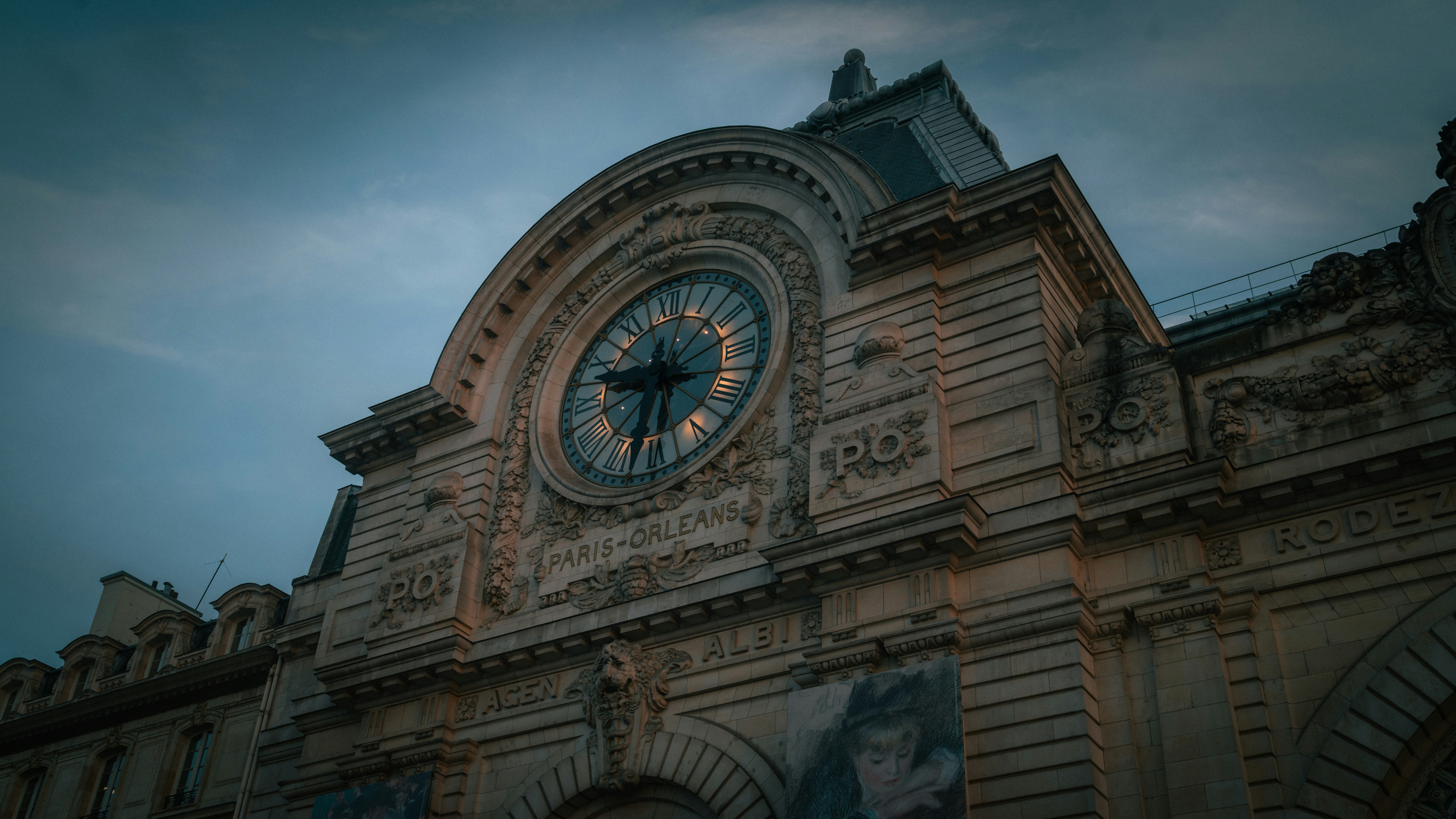 Parisian Clockhouse: A Timed Facade Under Soft Evening Light