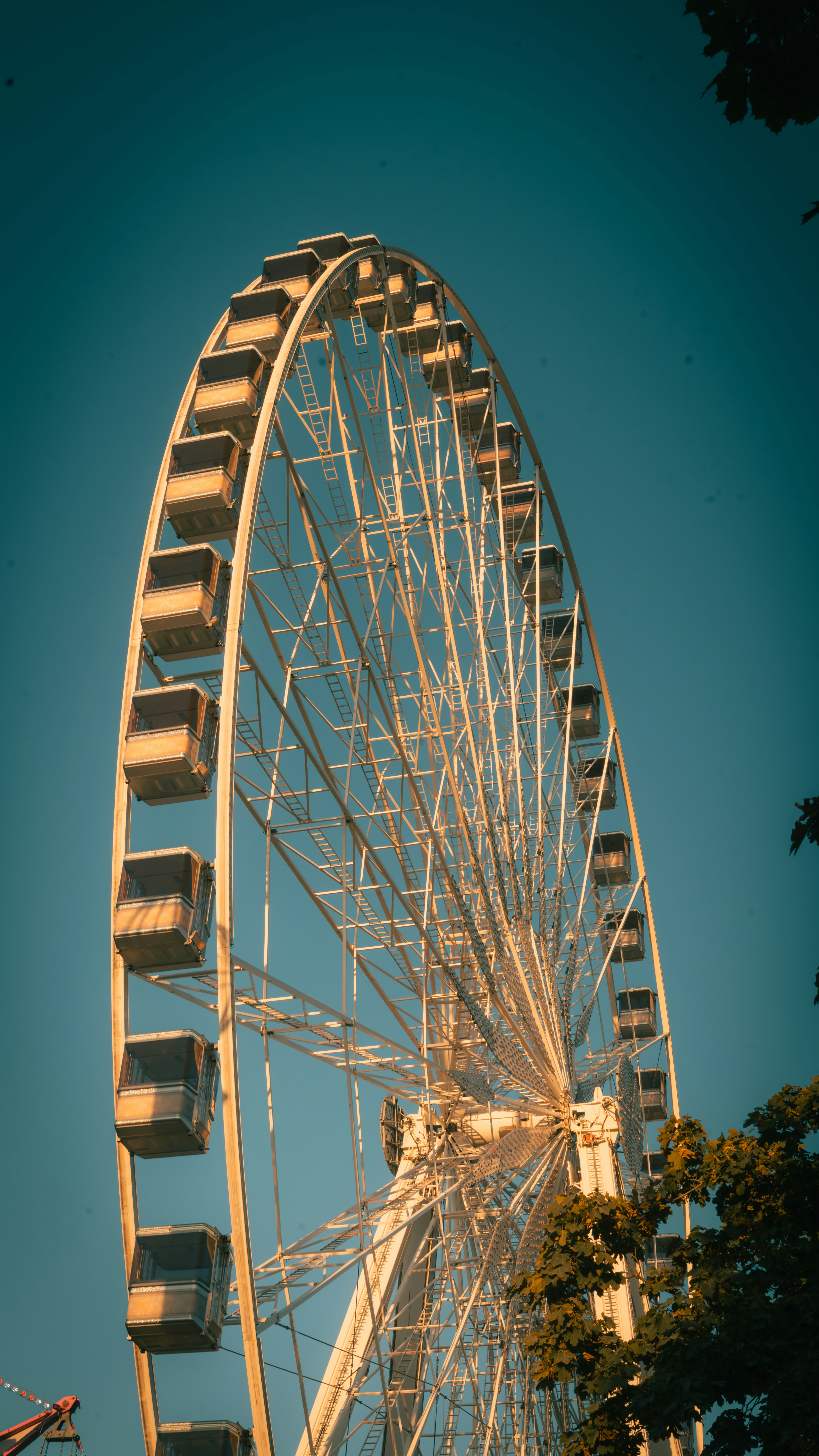Wheel of Light: A Vertical View into a Sunset Ferris Dream
