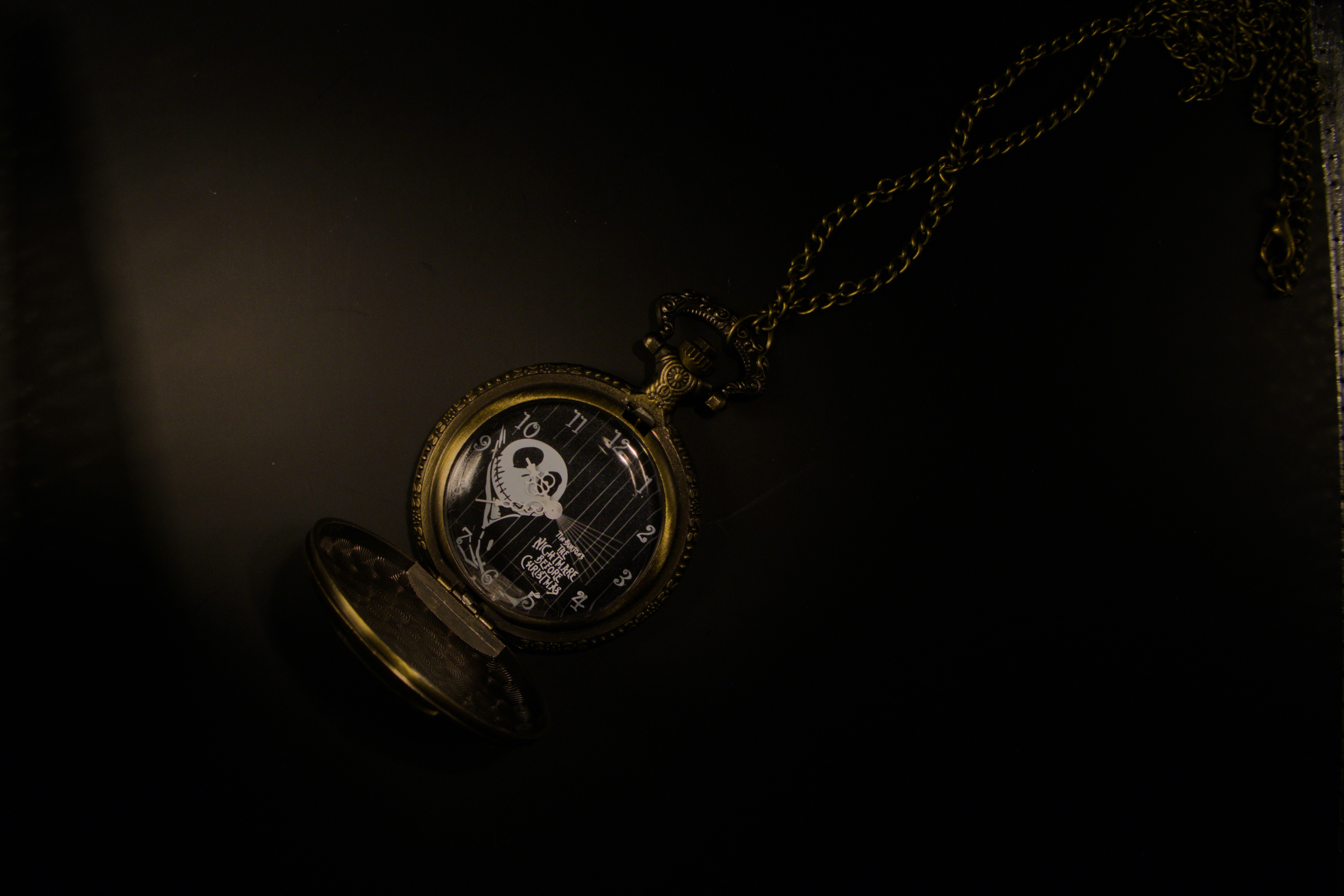 Amber-Toned Fob: A Pocket Watch Dangled in Shadow