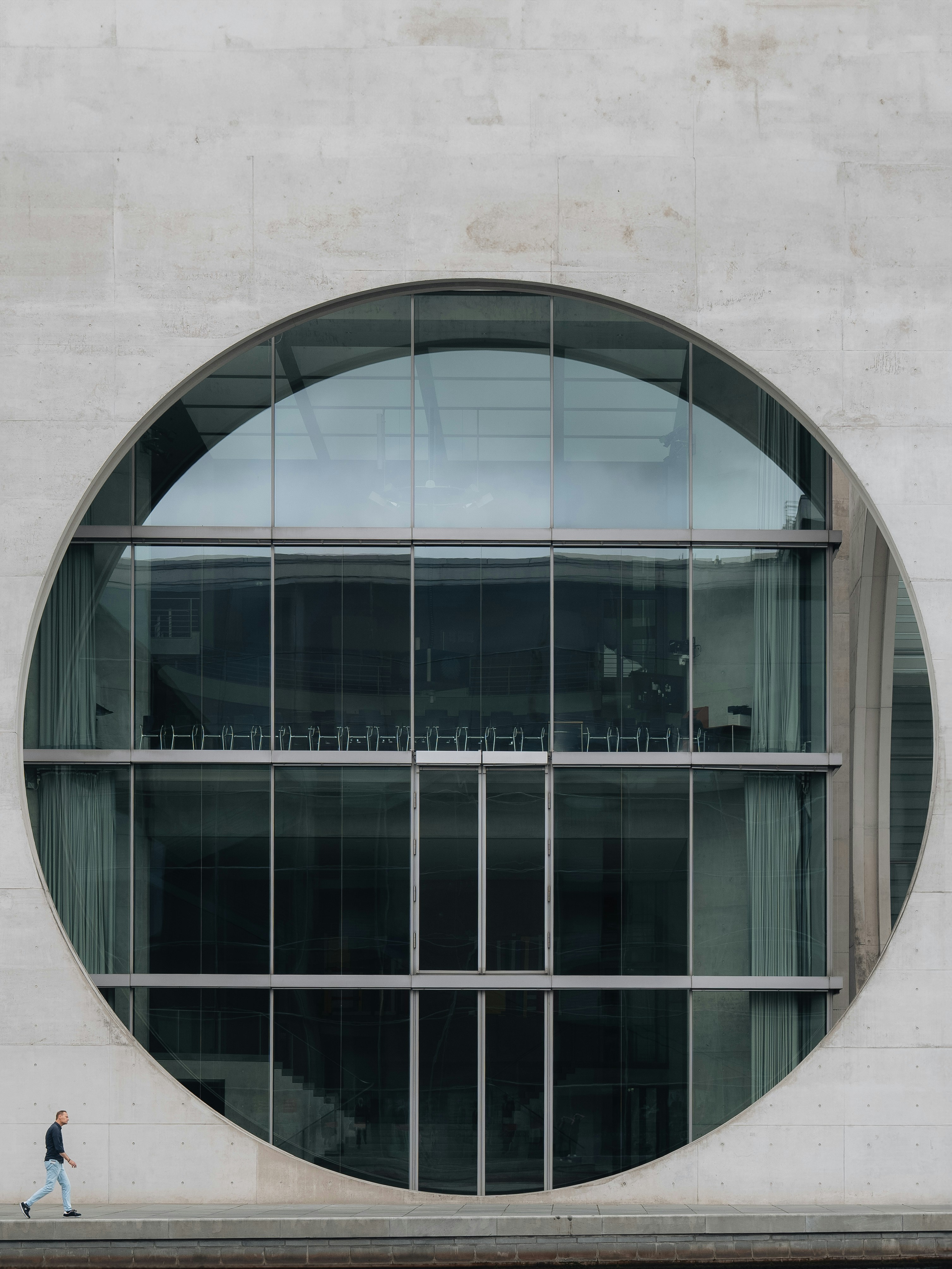 Circles of Glass: A Pedestrian by the Ringed Facade
